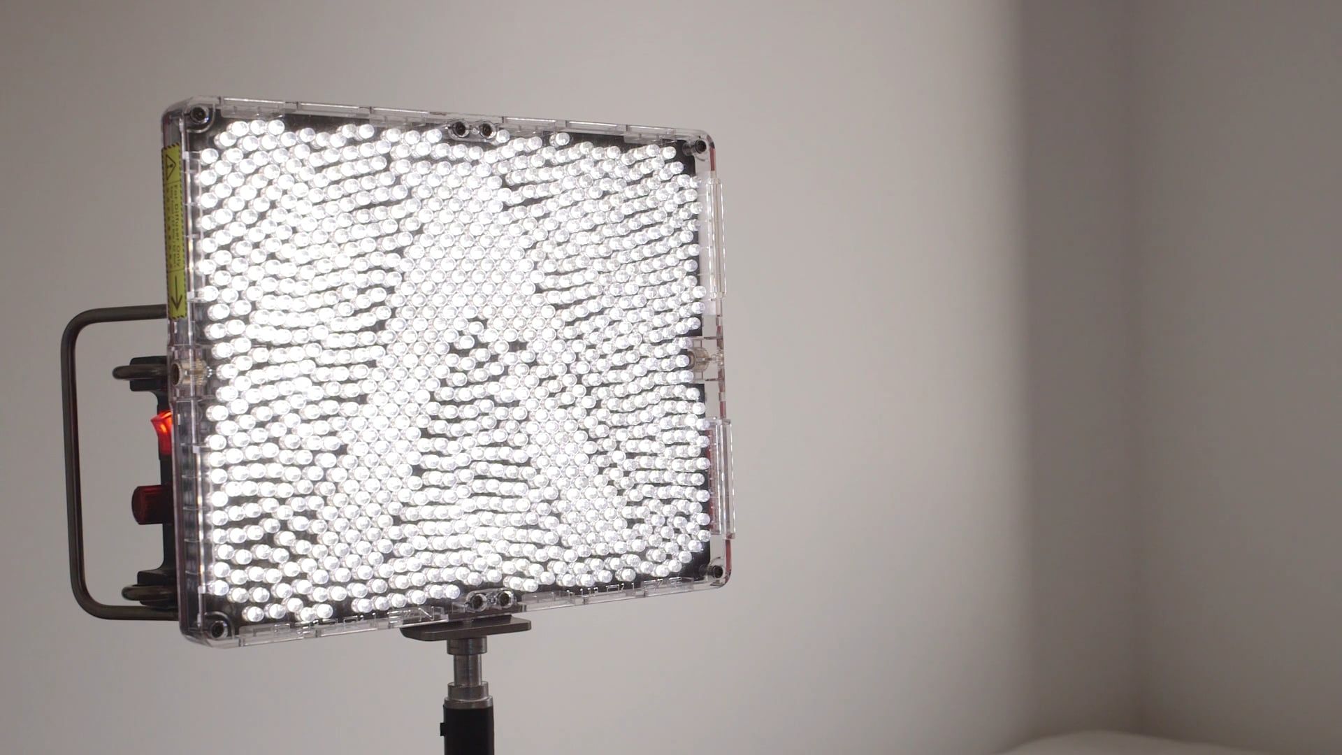 A Person Placing Sheet of Blue Film in front or a LED Panel Light Free ...