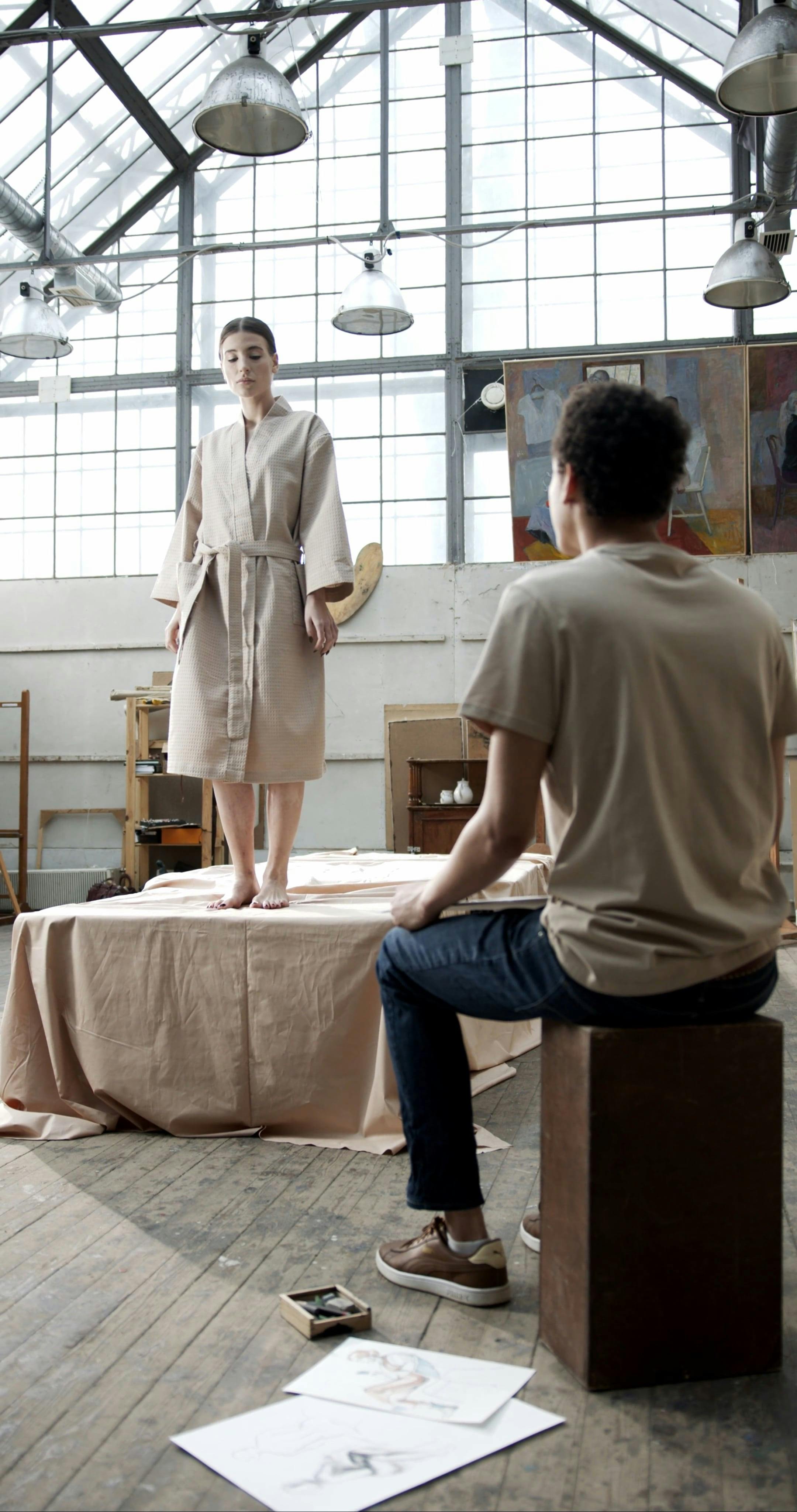 A Woman Disrobing To Start The Art Session · Free Stock Video