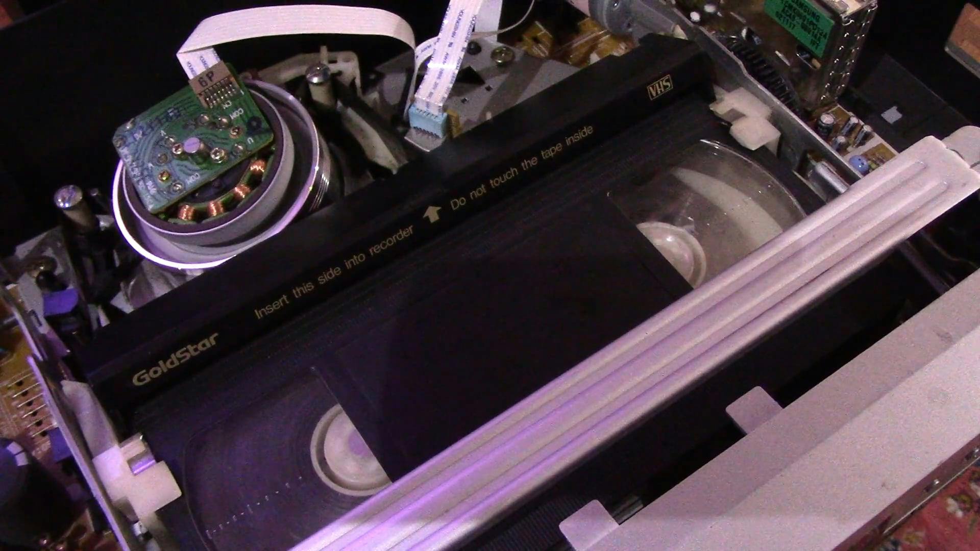 A VHS Tape inside a Player · Free Stock Video