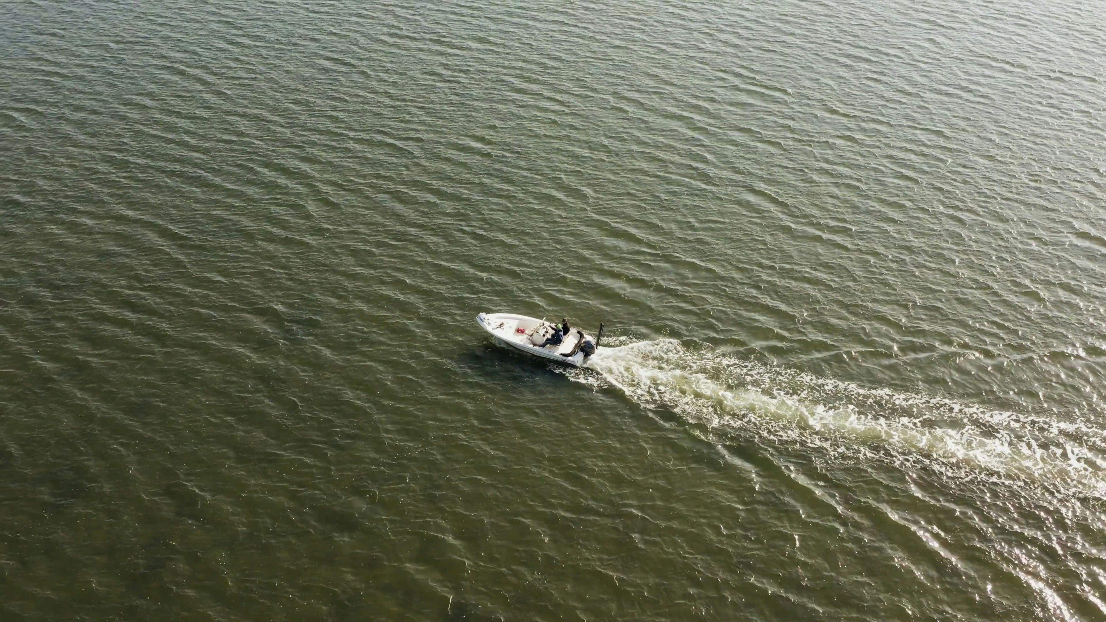 Motorboat Traveling Across A Body Of Water · Free Stock Video