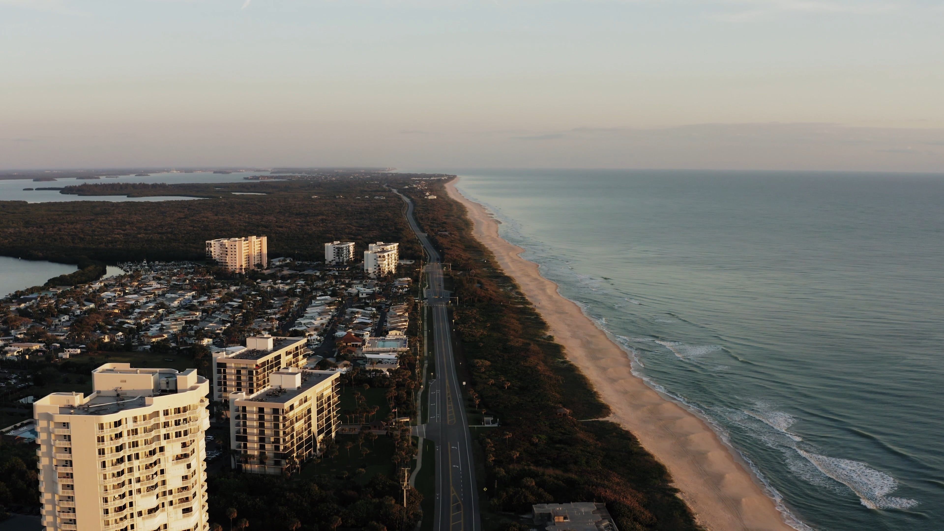 Drone Shot of a City by the Beach · Free Stock Video