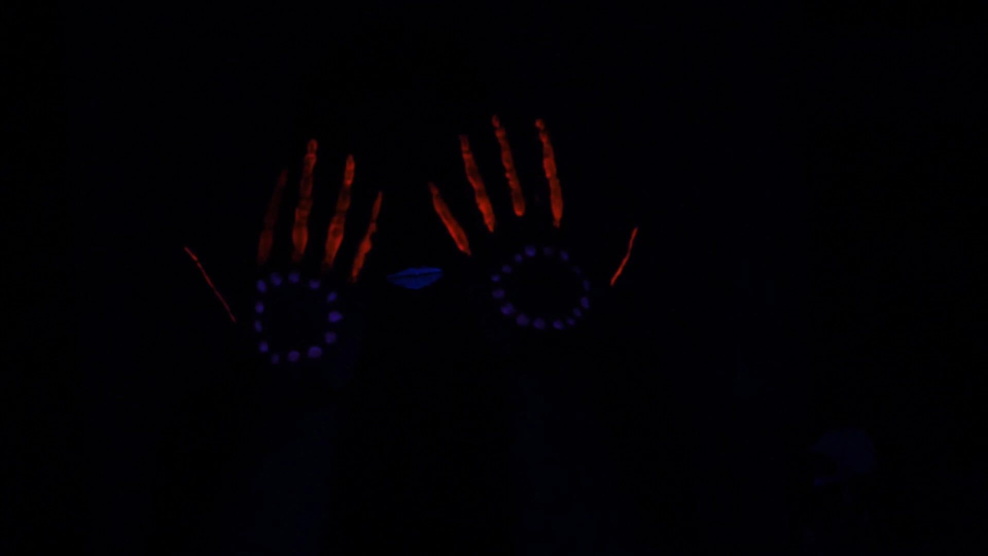 Hands Glowing With Glow In The Dark Paint · Free Stock Video