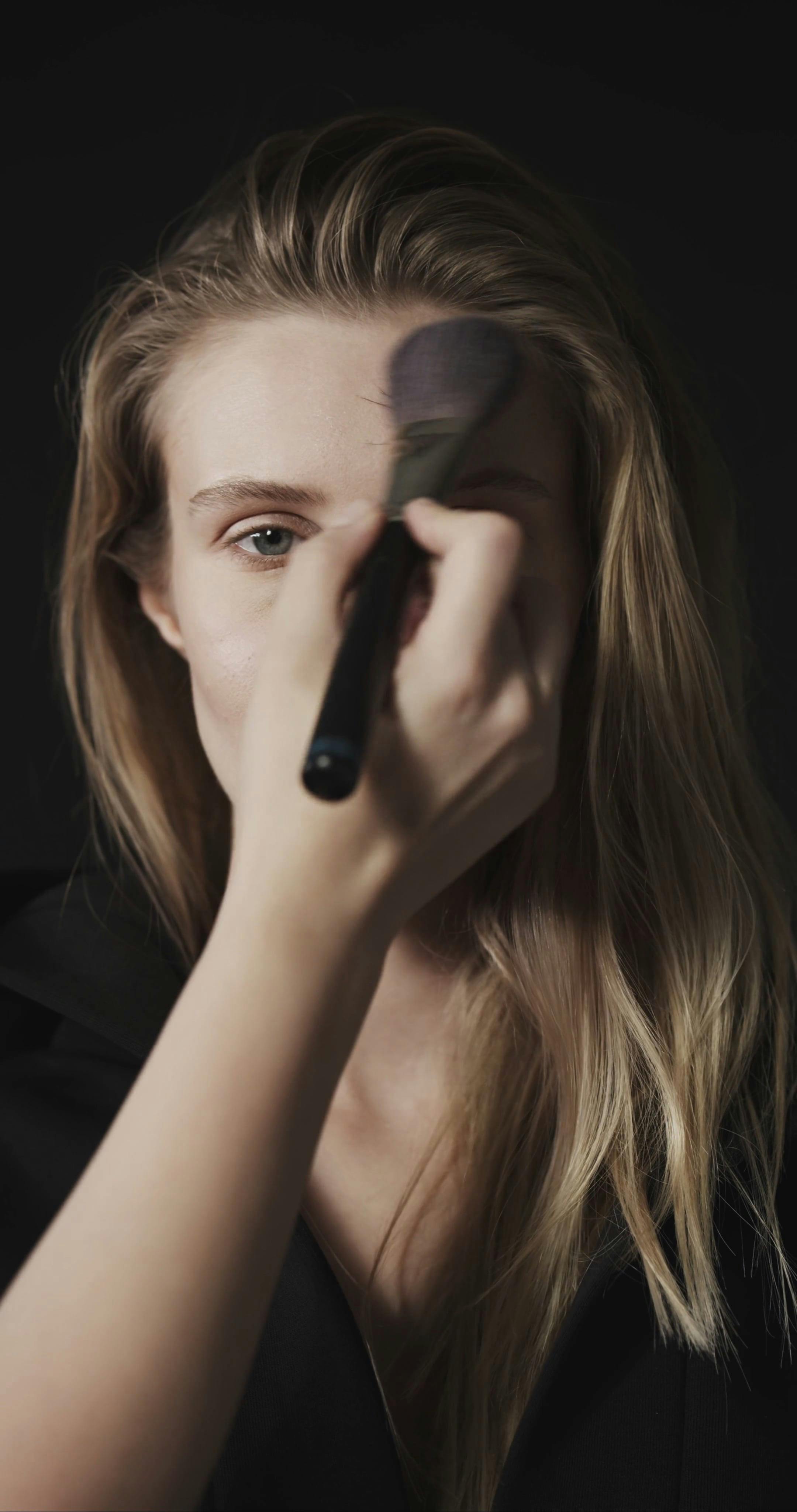 A Makeup Artist Applying Makeup On A Model · Free Stock Video