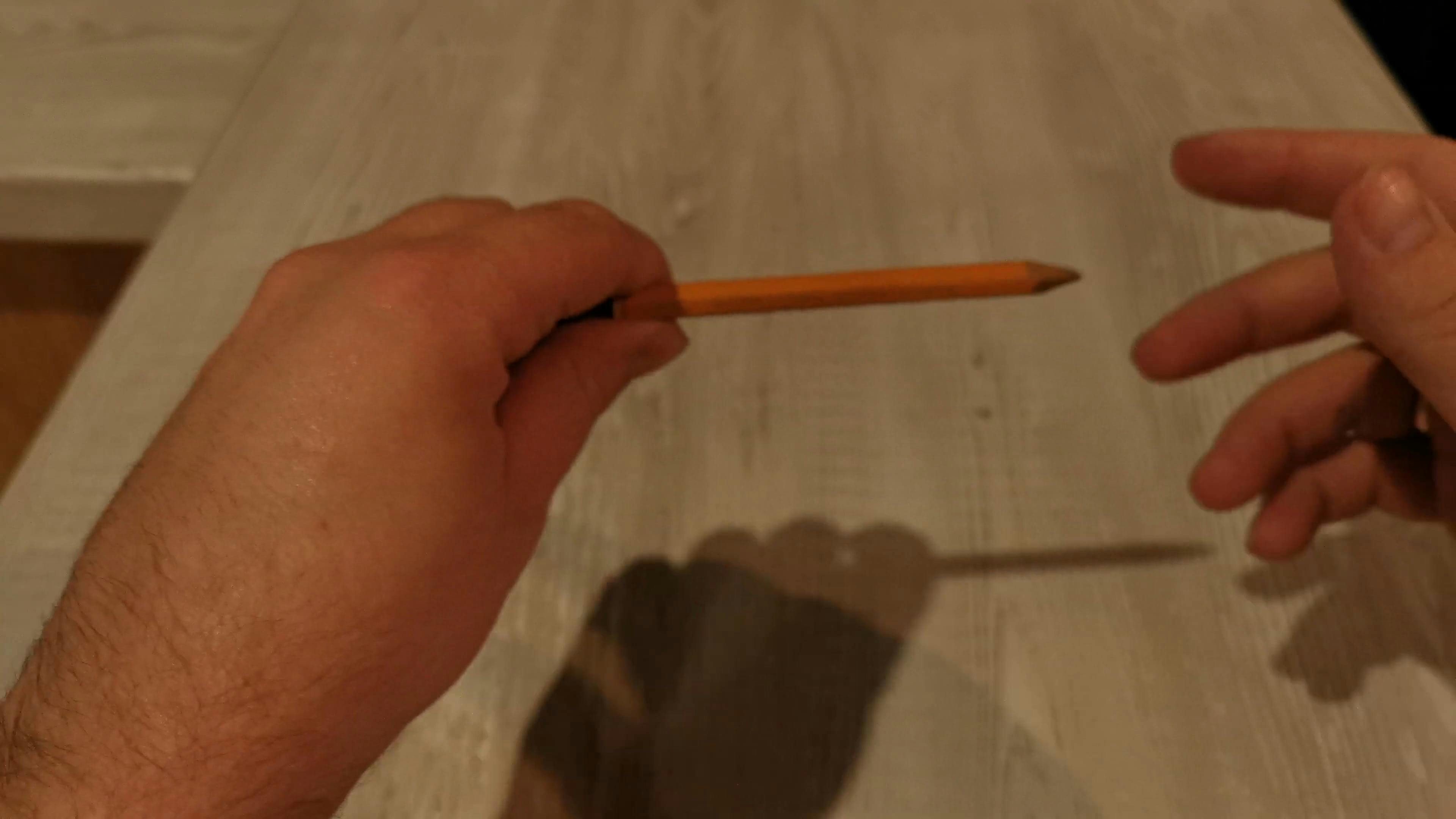 A Person Breaking a Pencil in Half · Free Stock Video