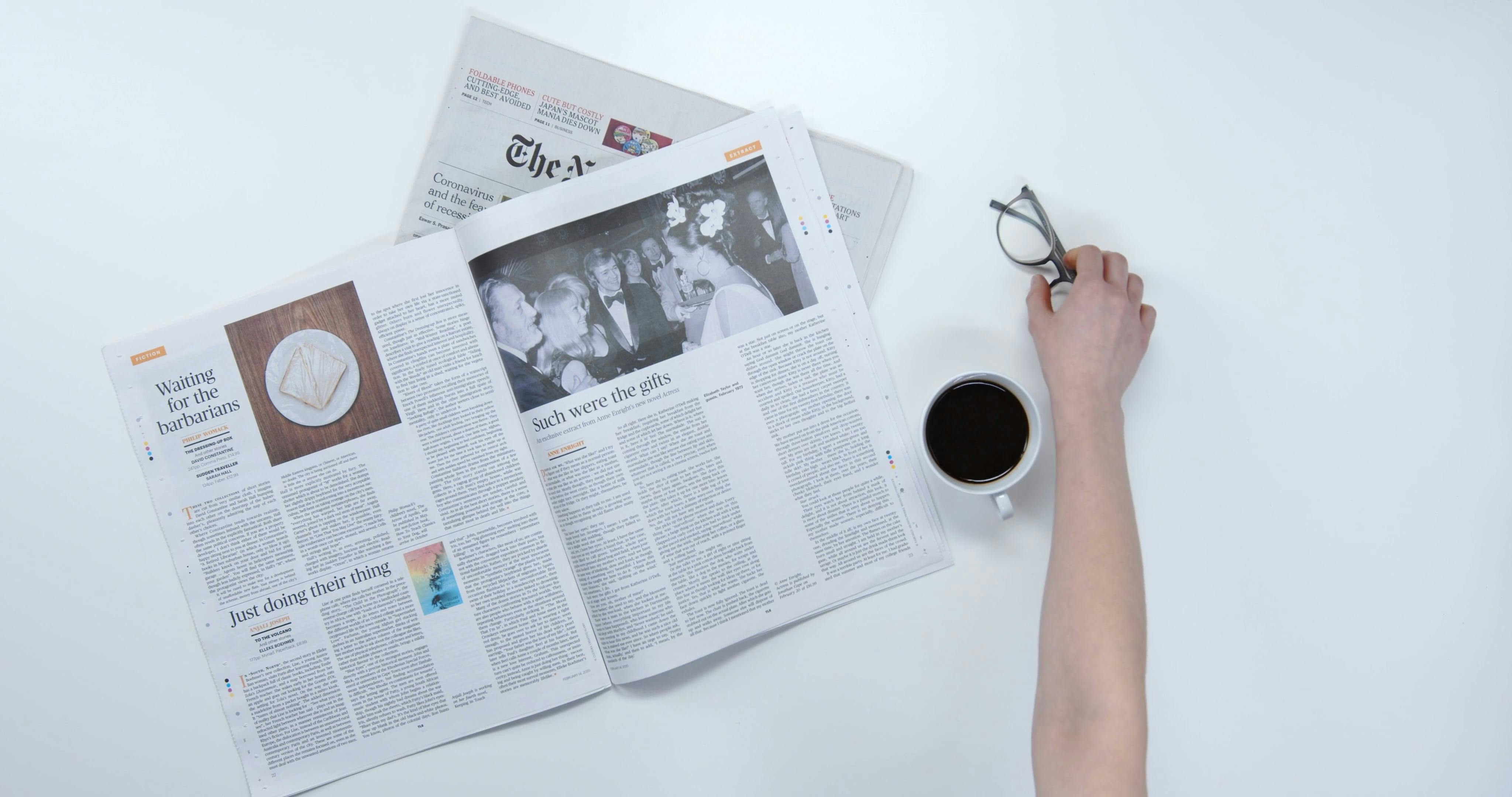 Using An Eyeglass For Reading A Newspaper · Free Stock Video