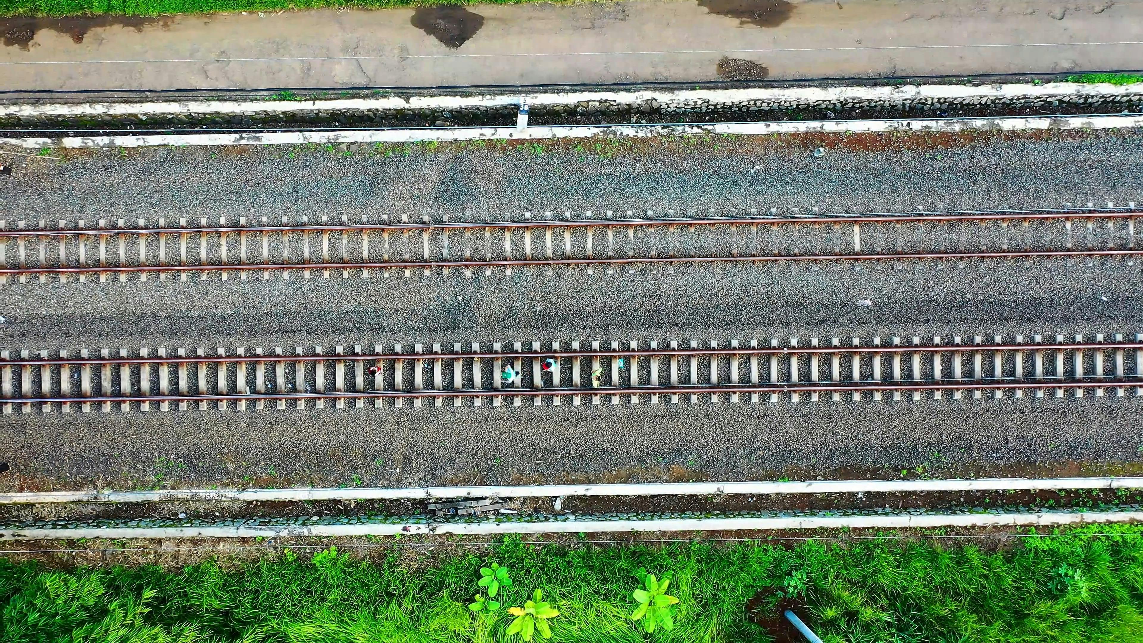 A Man Running Barefooted On The Inside Of A Rail Track · Free Stock Video