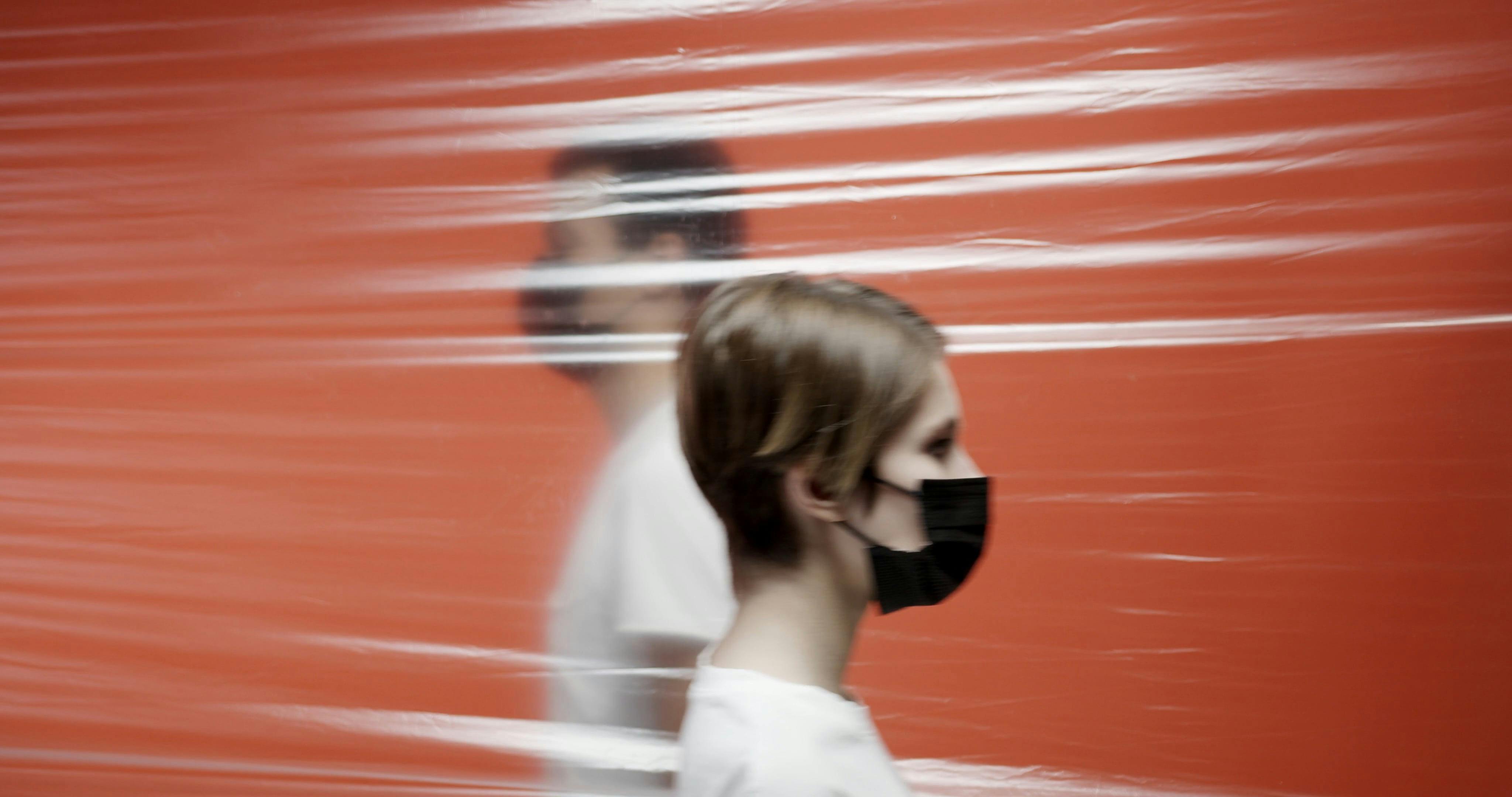 A Couple In Quarantine Separated By Plastic Walls For Protection ...