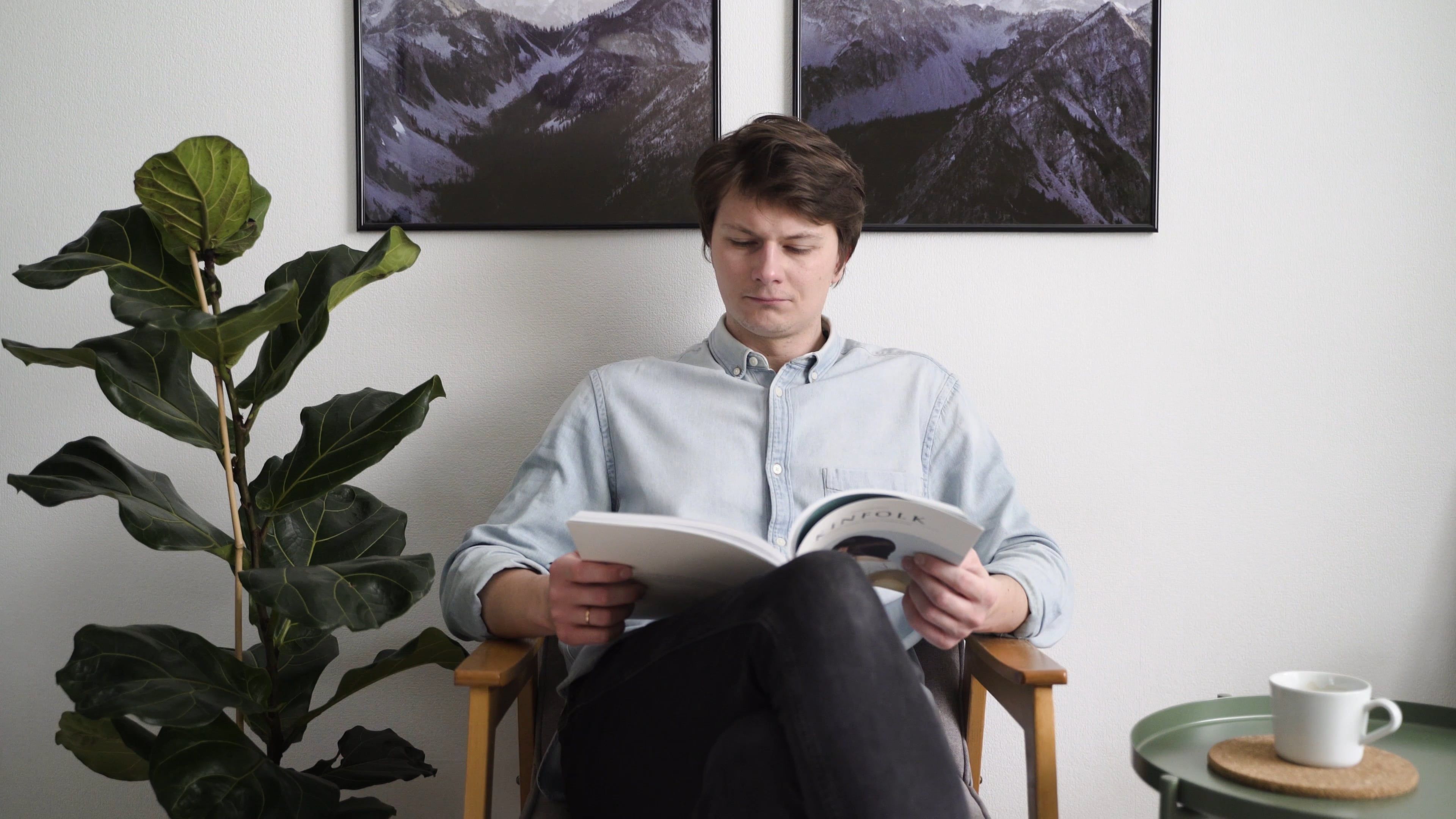 Man Sitting on Chair Reading a Magazine · Free Stock Video