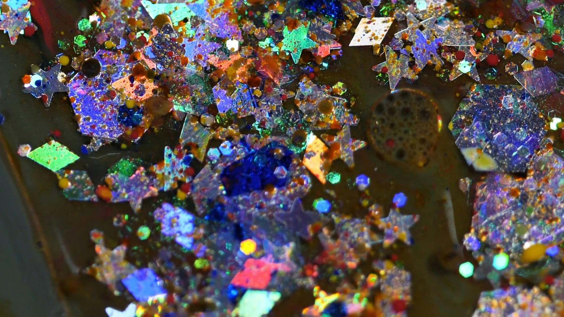 Close-up Footage of Glitters Flowing on a Water Free Stock Video ...