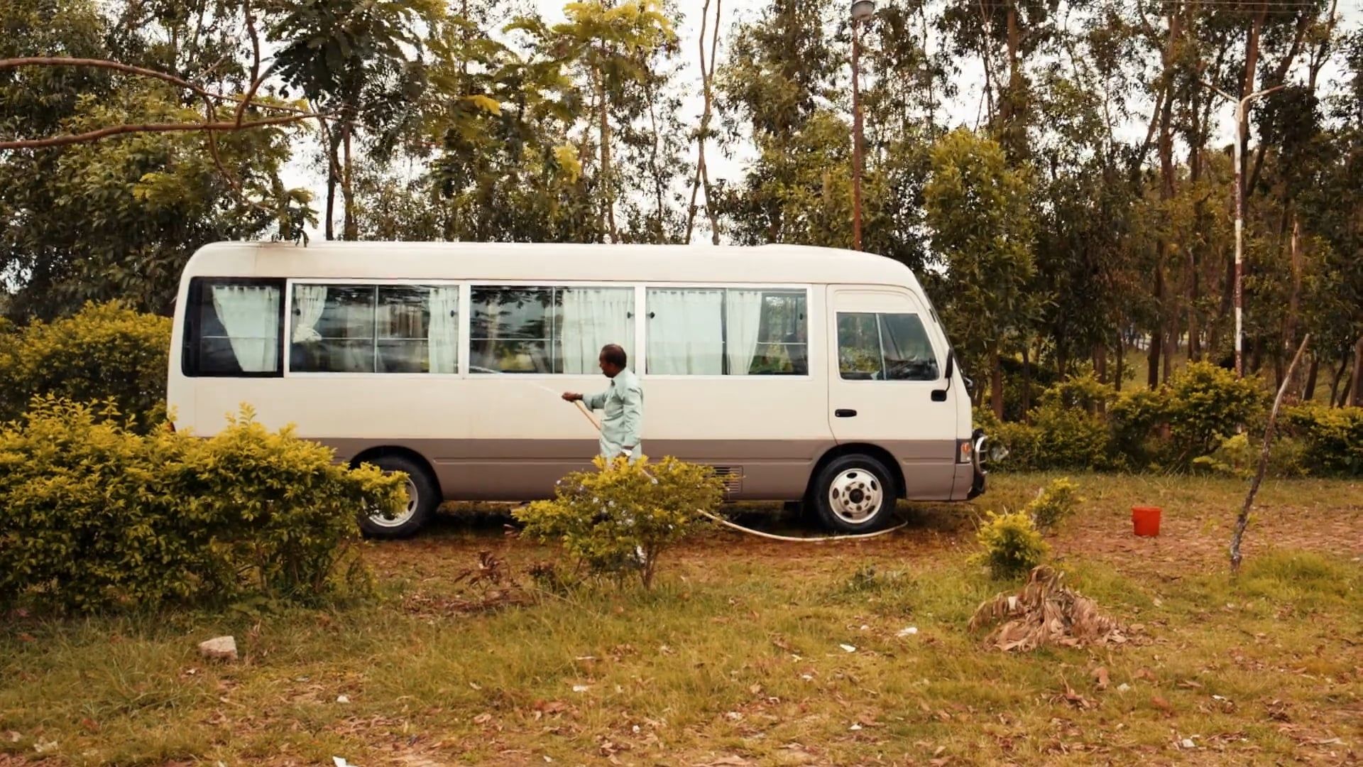 A Man Washing A Commuter Van In The Yard Free Stock Video Footage ...
