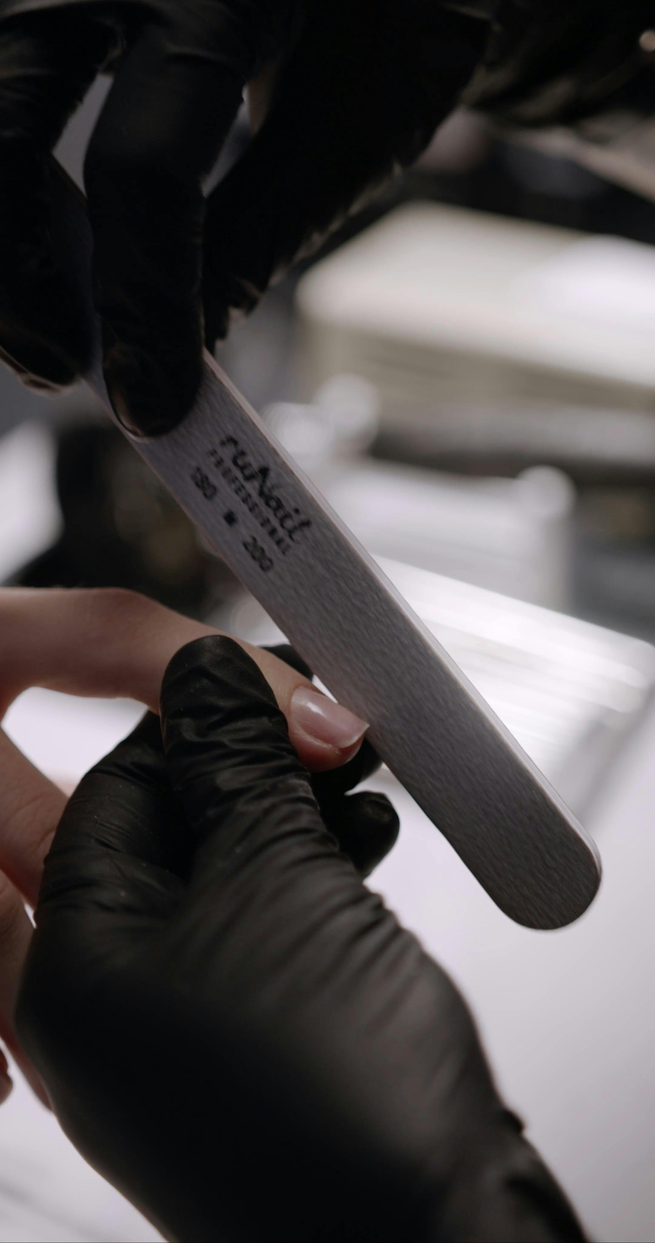 Nail Filing A Clients's Fingernails · Free Stock Video