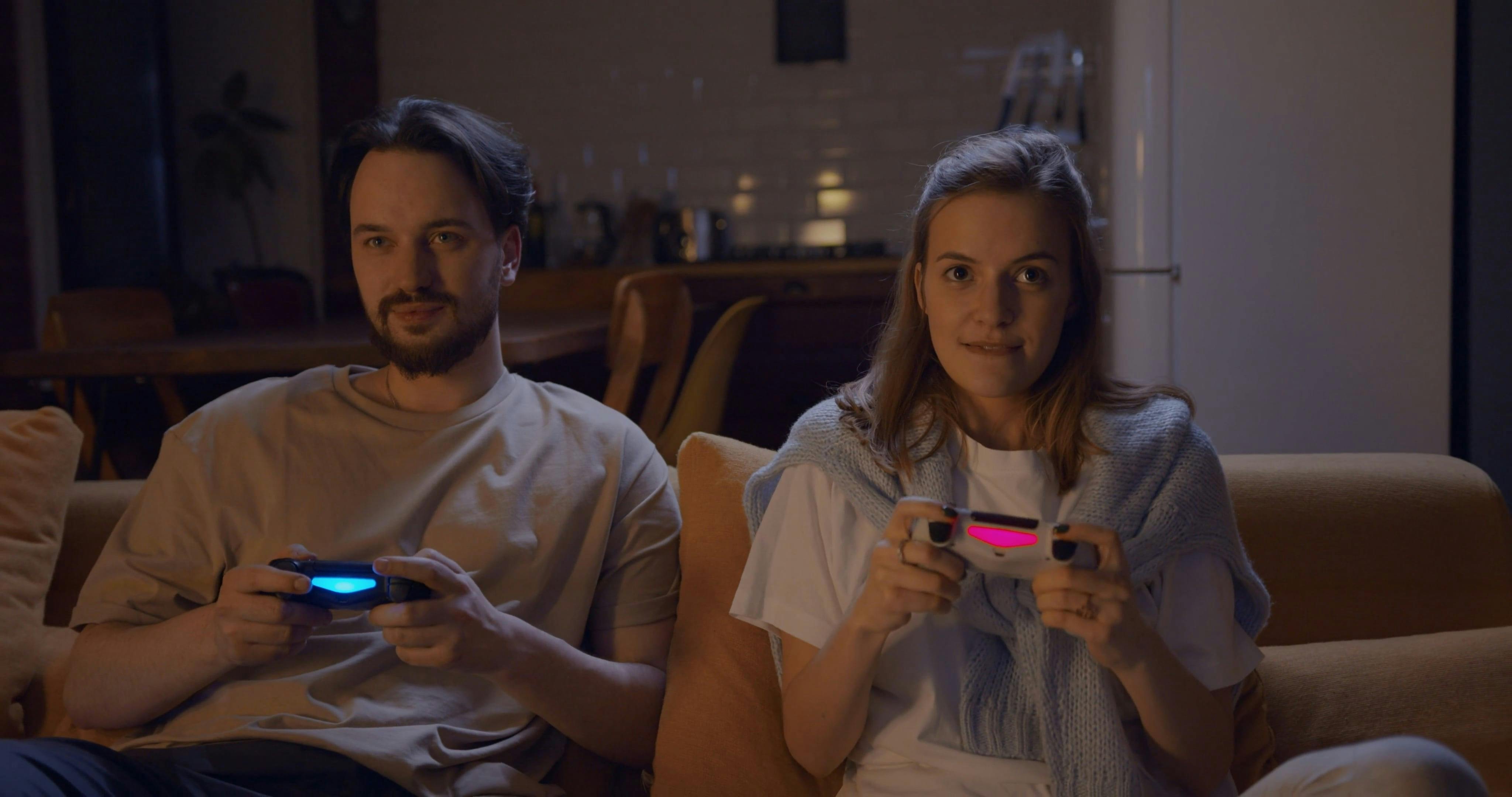 A Couple Playing A Game Console Using Wireless Remote Controls · Free ...