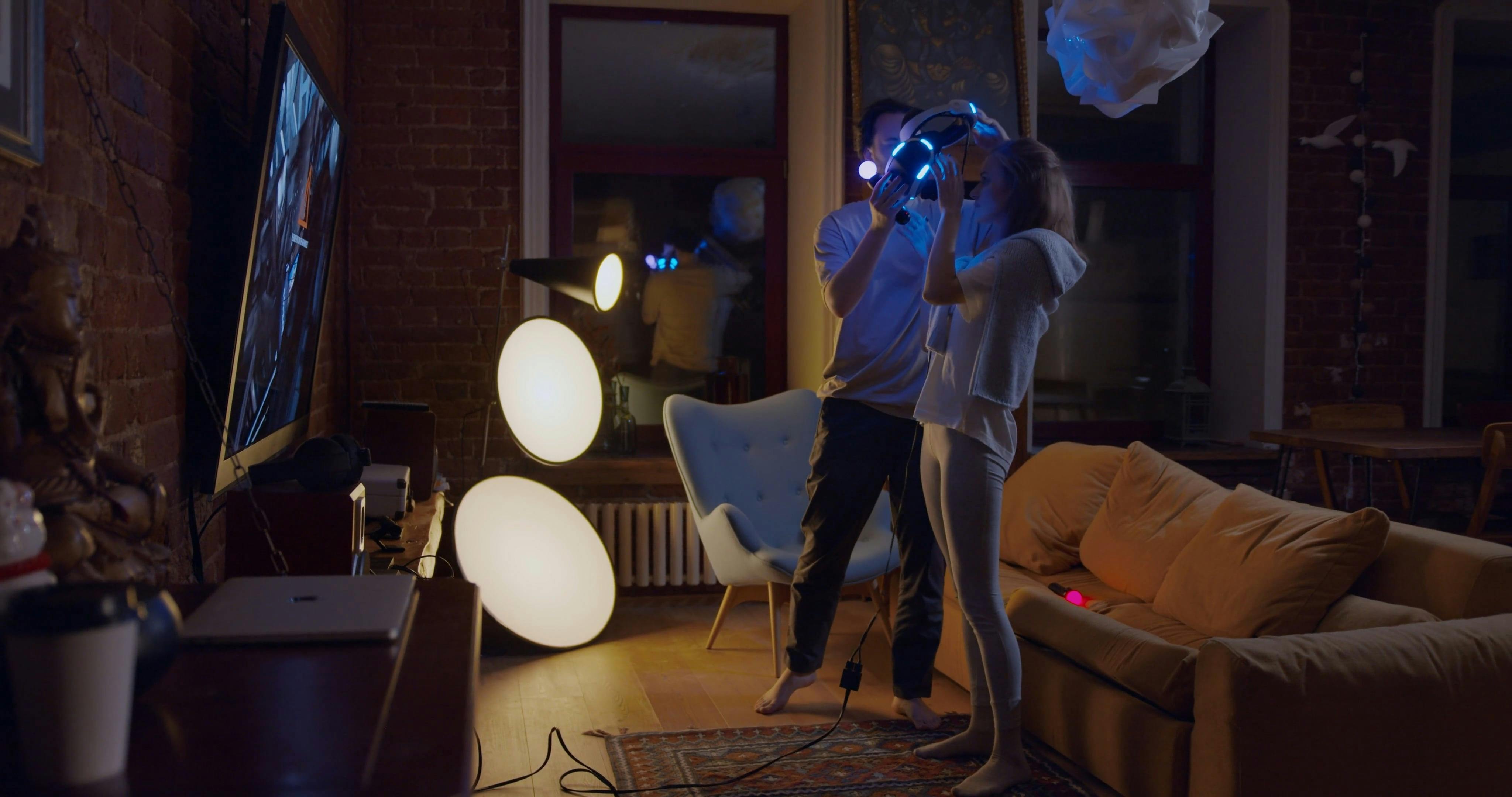 A Man Helping Her Partner Wear The Virtual Reality Game Gear Free Stock ...