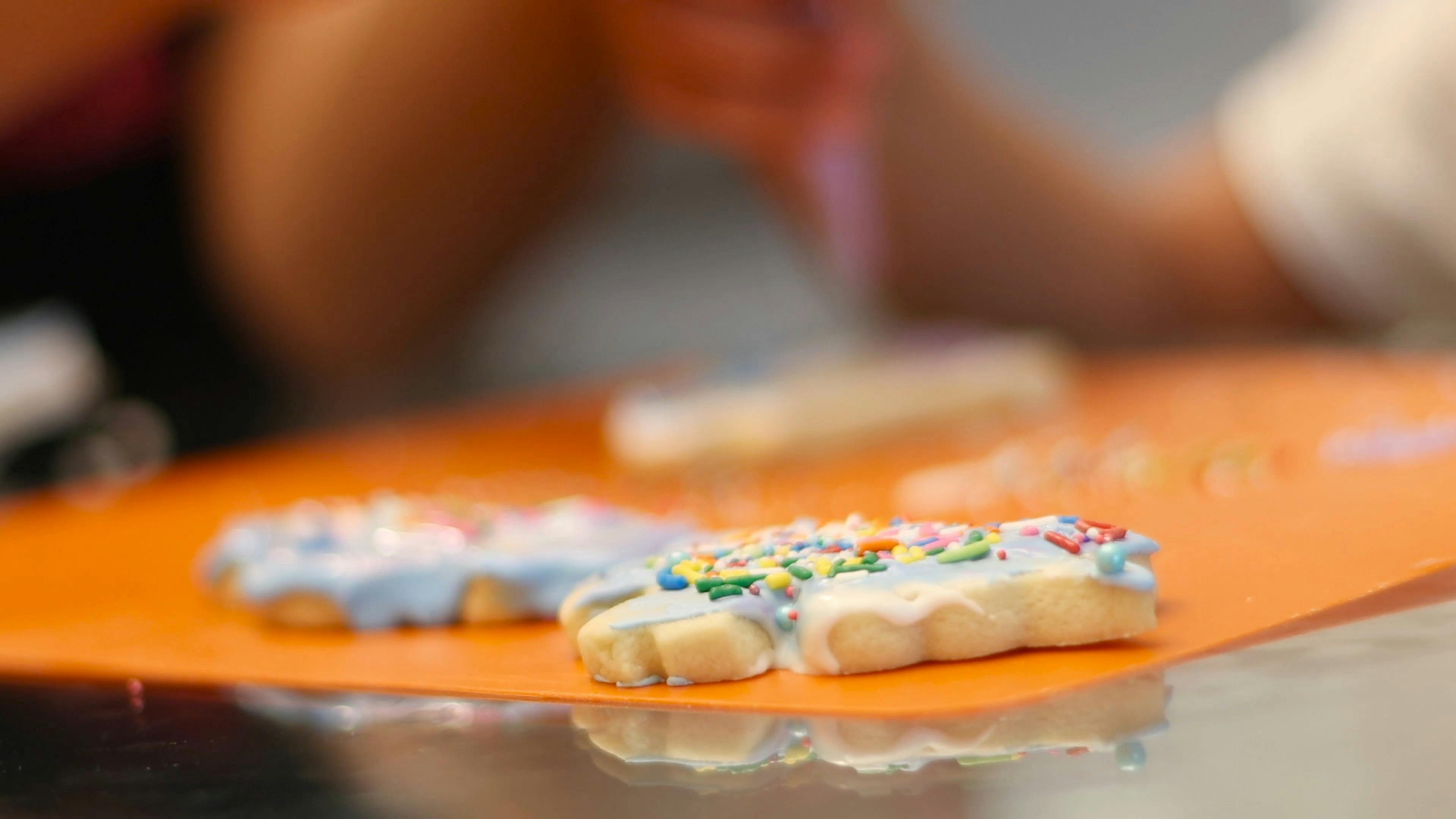 A Child Decorating a Cookie · Free Stock Video