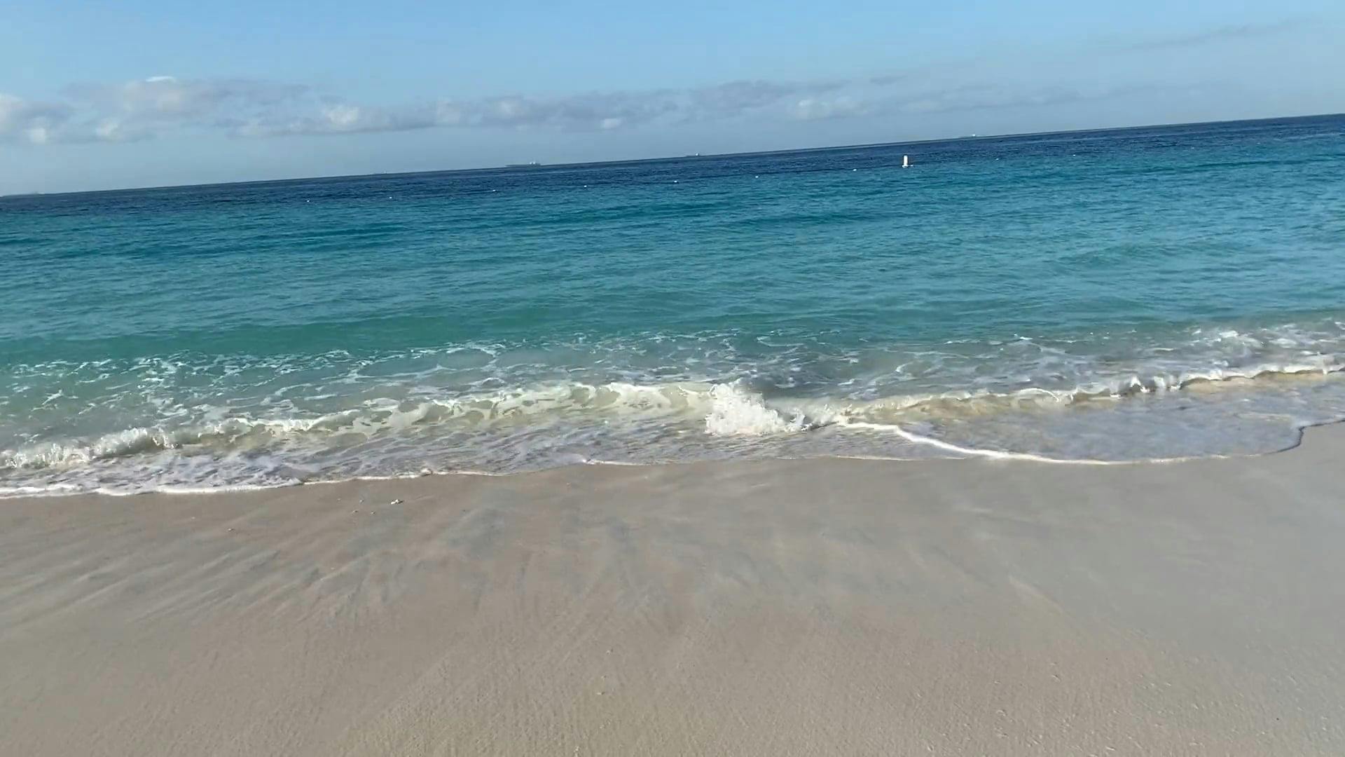 Low Angle Shot Of A Beach With Stones On Shore · Free Stock Video