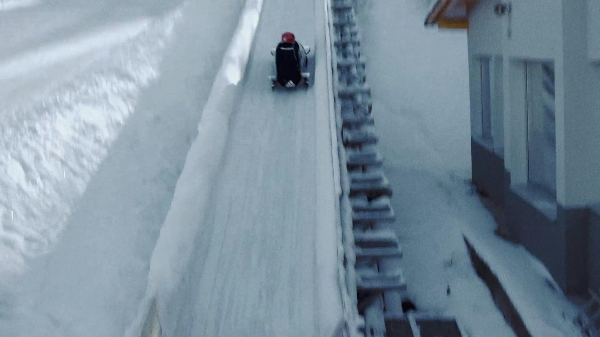 A Bobsled Approaching a Turn at a Track · Free Stock Video