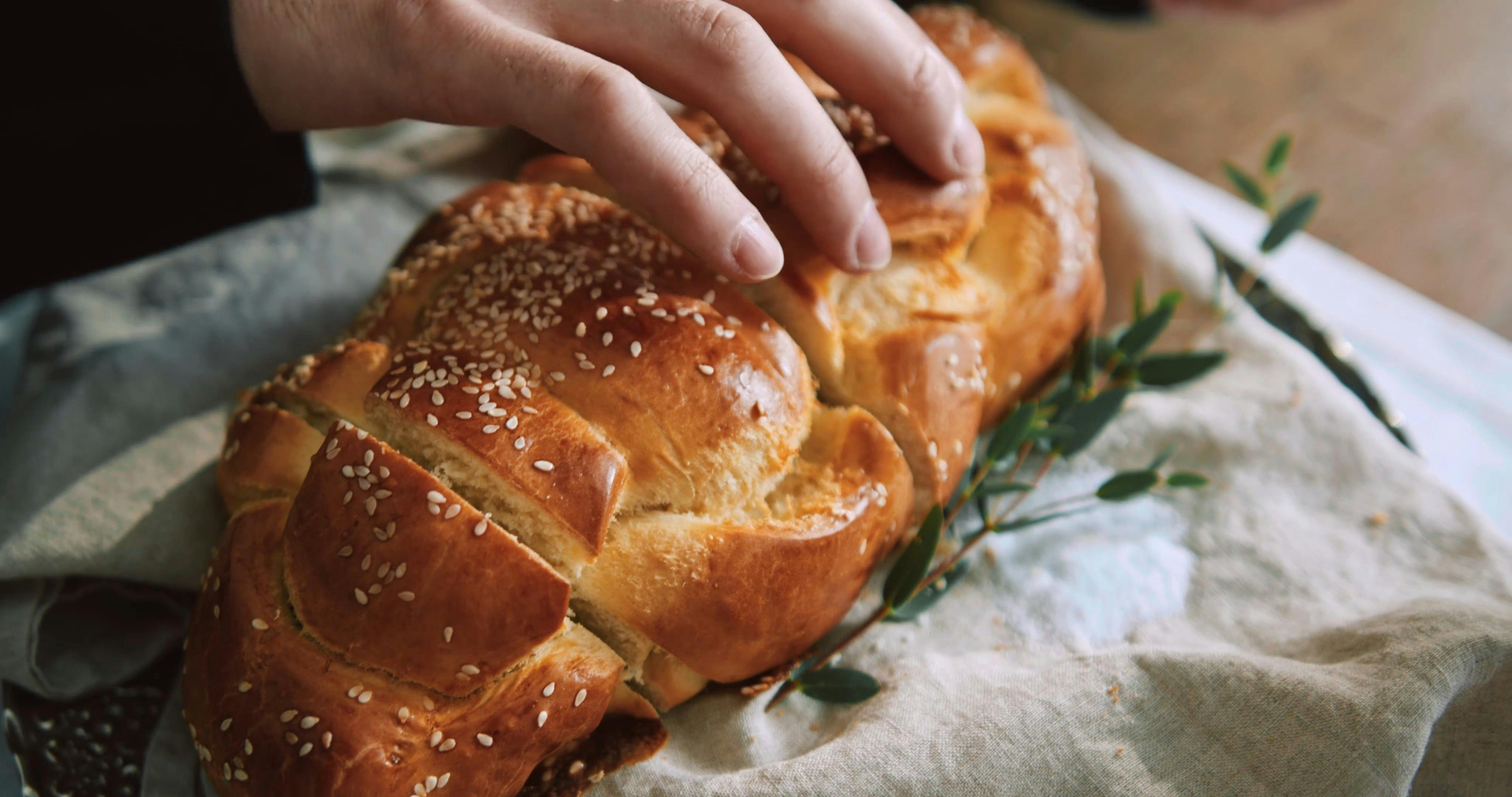 Breaking A Challah Bread To Eat · Free Stock Video