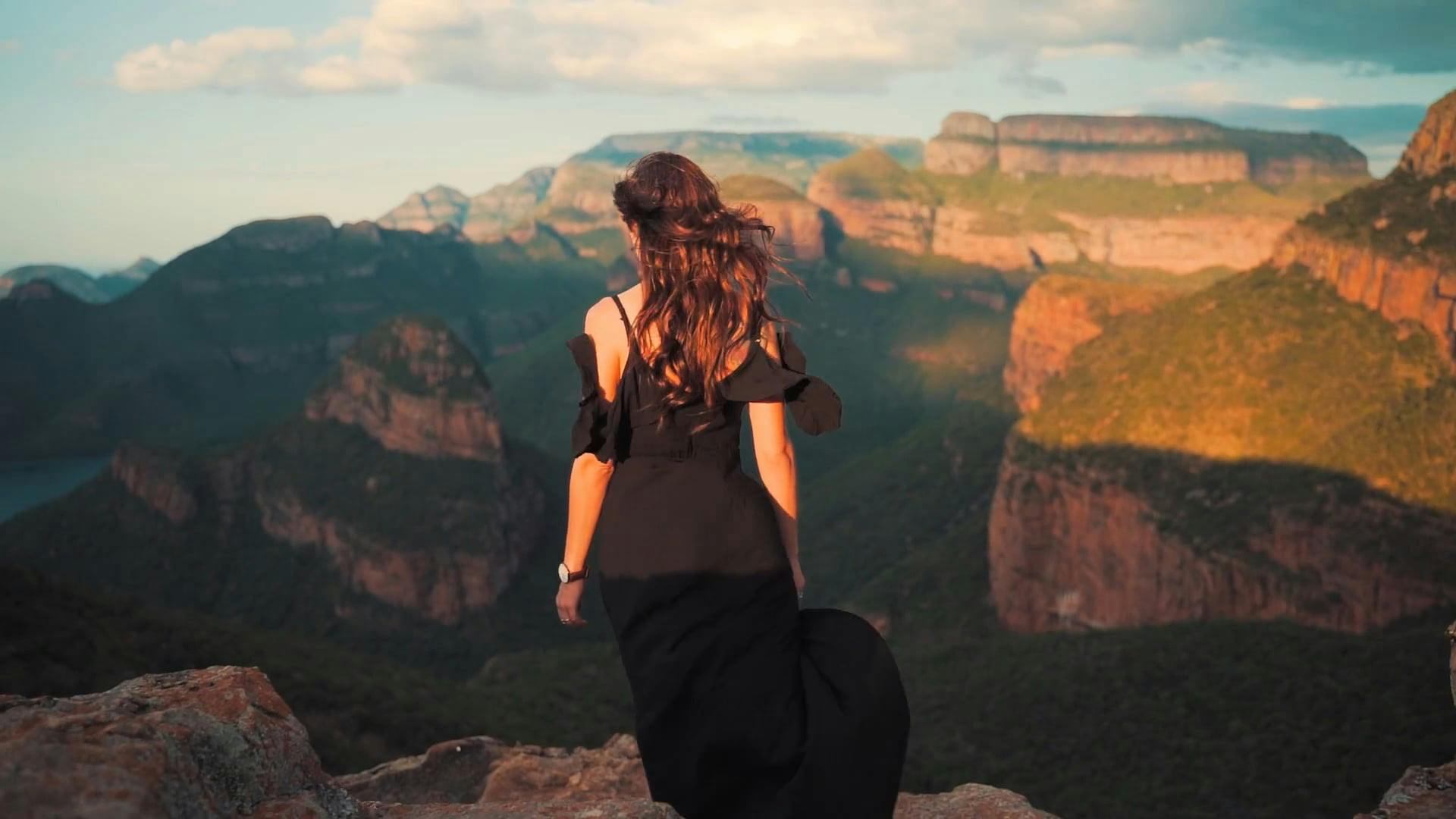 Woman Walking Towards the Cliff Enjoying the Mountain View · Free Stock ...