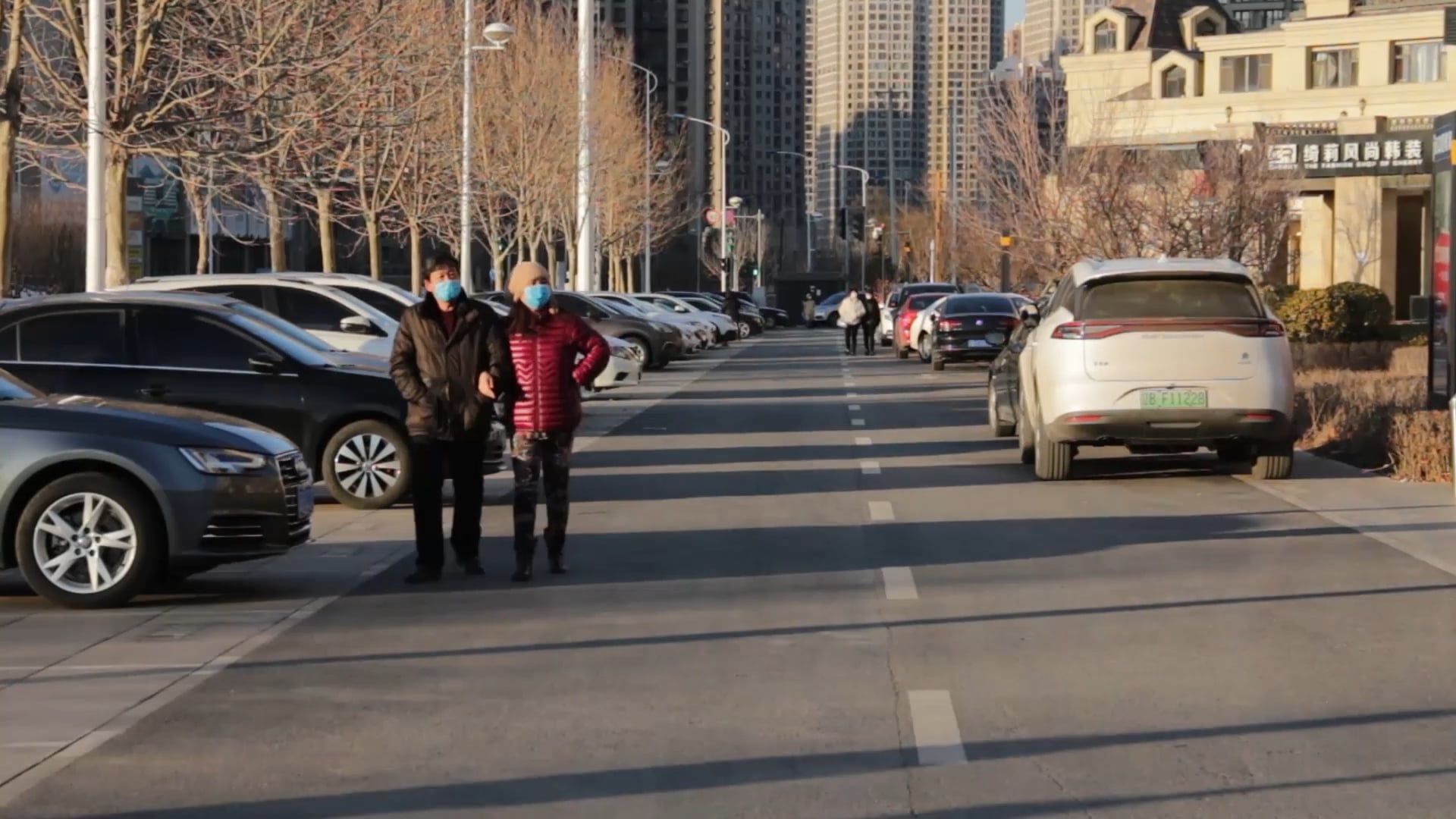 A Couple Wearing Face Mask Walking in the Street Free Stock Video ...