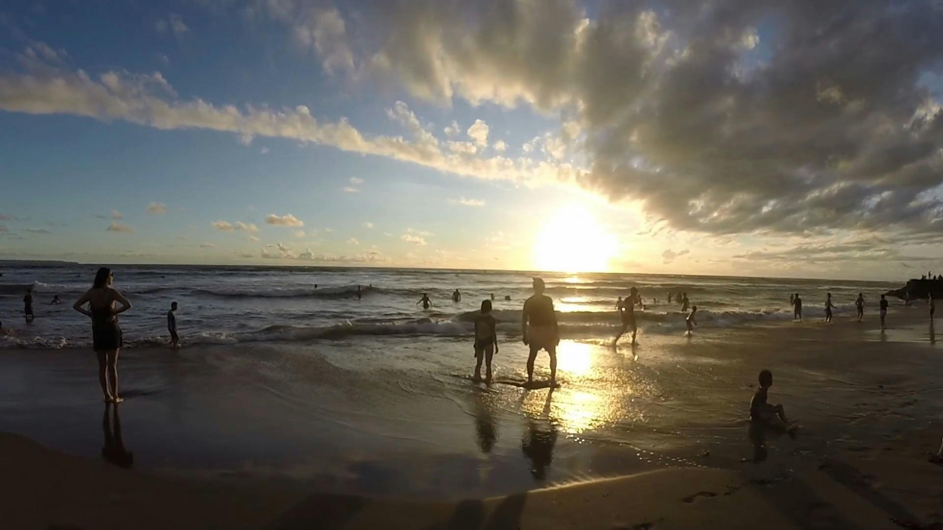 People On The Beach Looking At Sunset · Free Stock Video