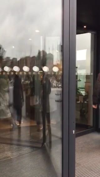 People Entering A Building Through The Revolving Door Free Stock Video ...
