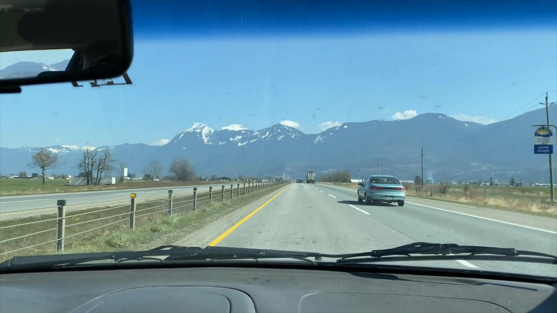 Driving on a Highway with Mountain View in Front · Free Stock Video