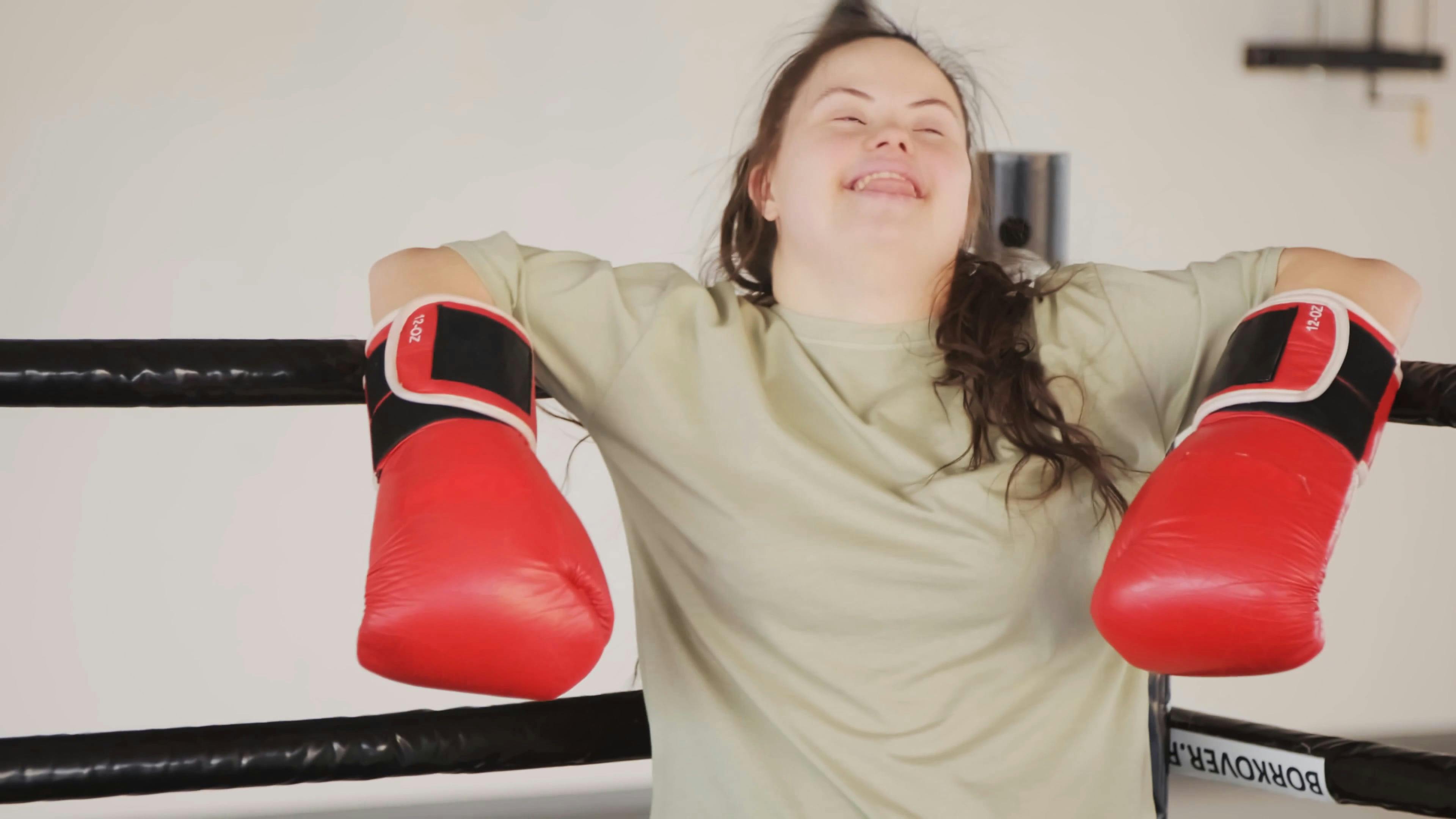 Girl With Down Syndrome Wearing Boxing Gloves · Free Stock Video