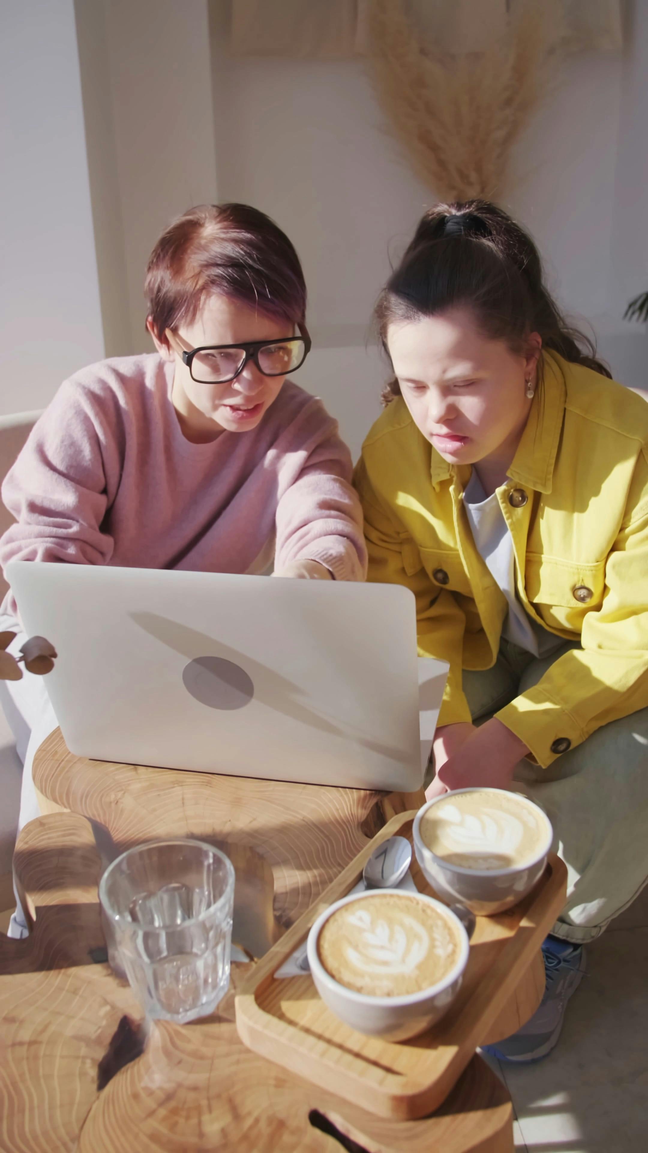 Women Discussing Something in the Laptop · Free Stock Video