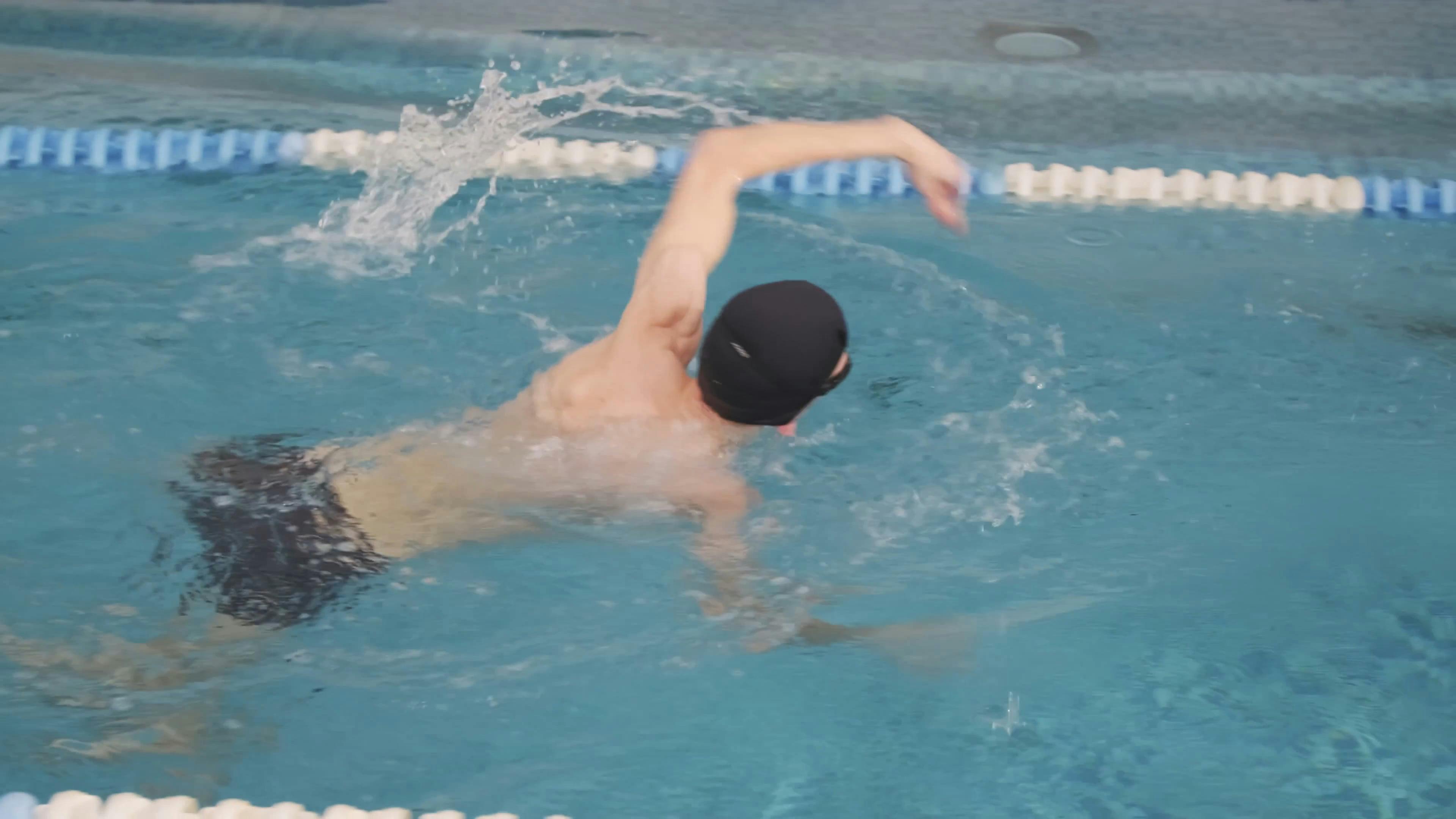 A Man Doing Laps in the Indoor Swimming Pool · Free Stock Video