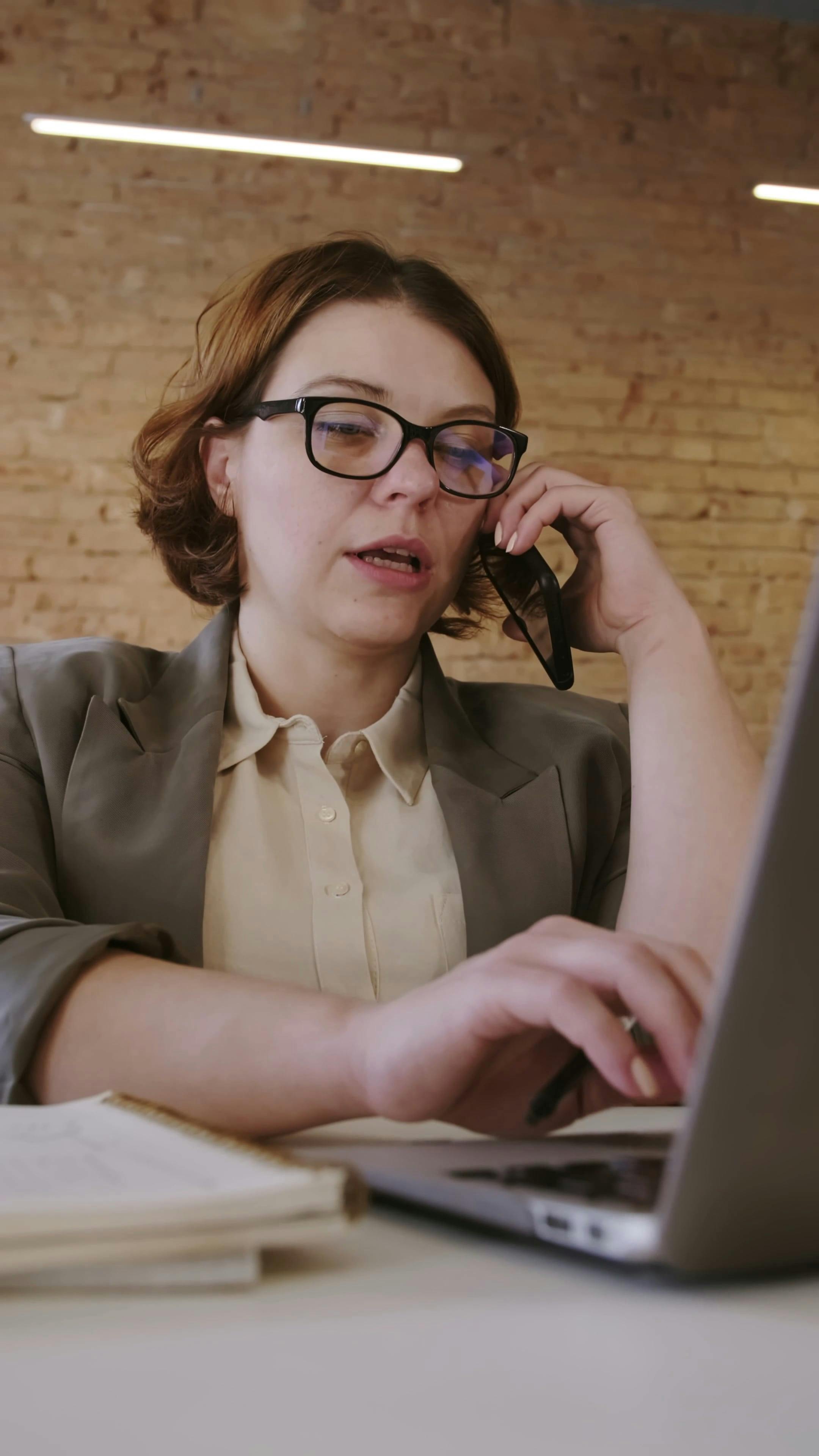 A Woman on a Phone Call Doing Work · Free Stock Video