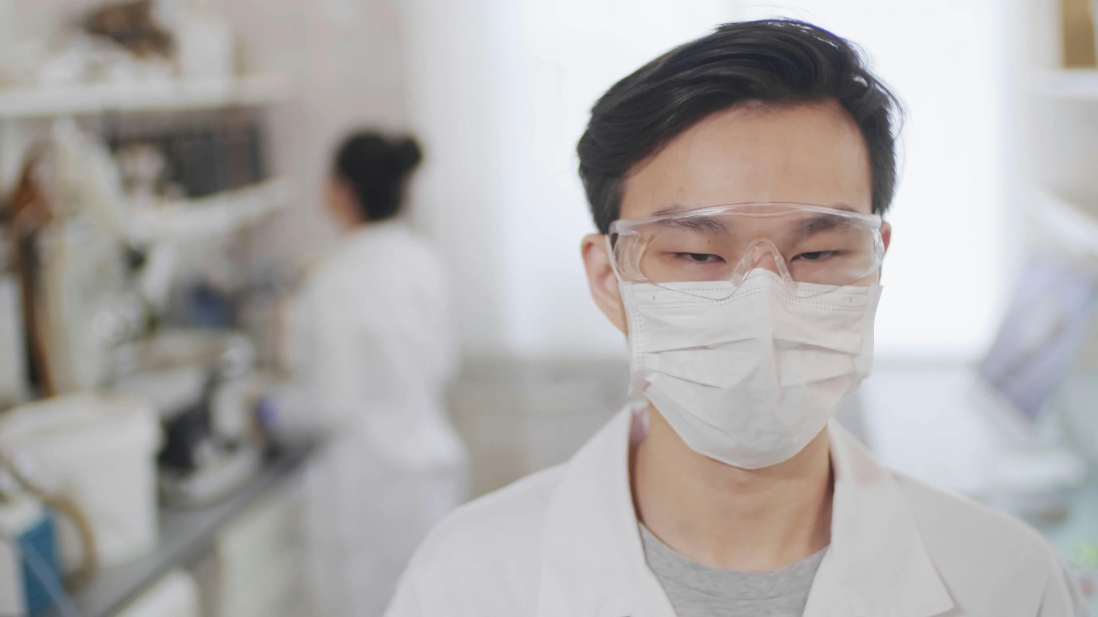 A Man Standing in the Laboratory Looking at the Camera · Free Stock Video