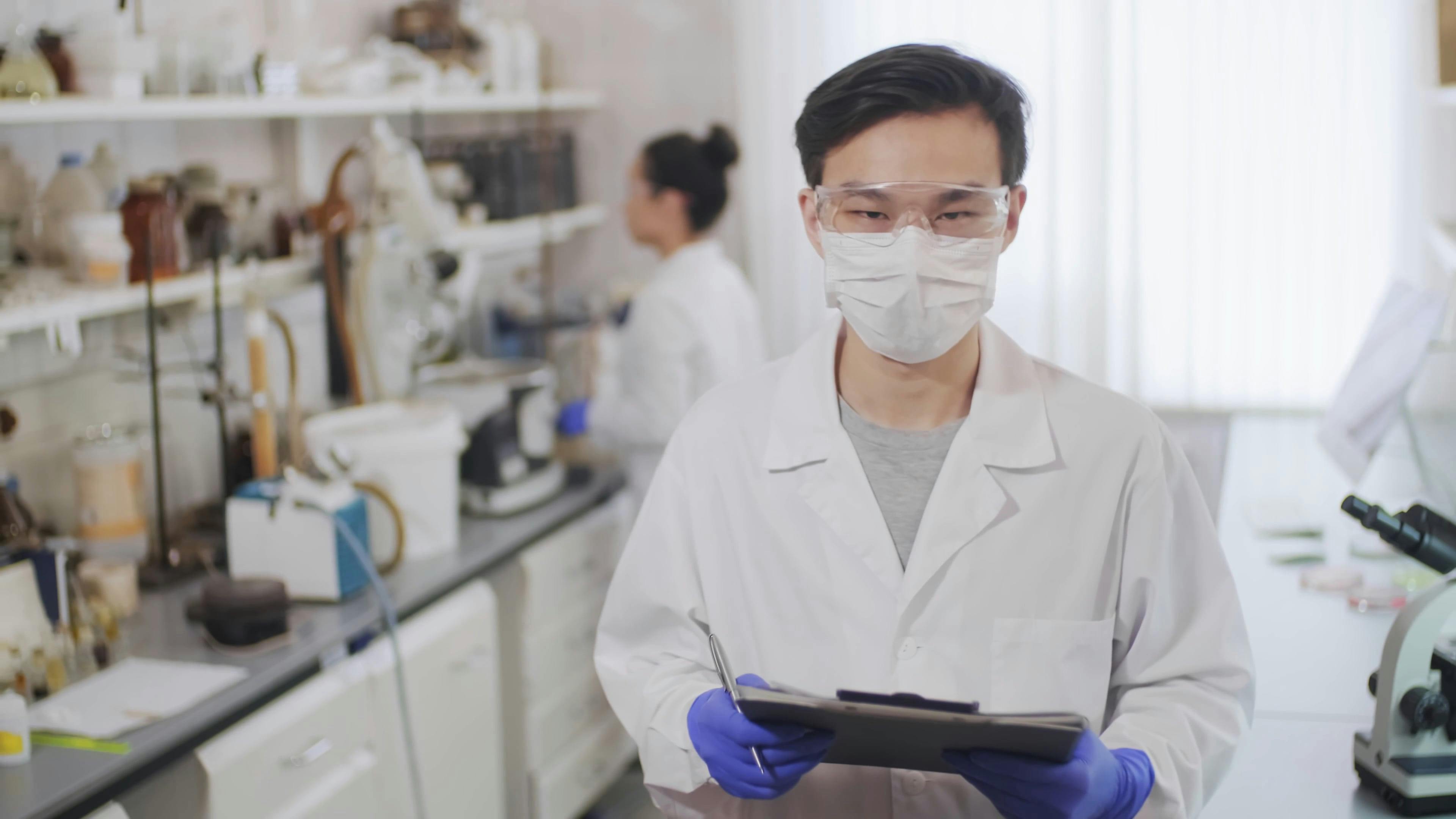 A Man Standing in the Laboratory Looking at the Camera · Free Stock Video