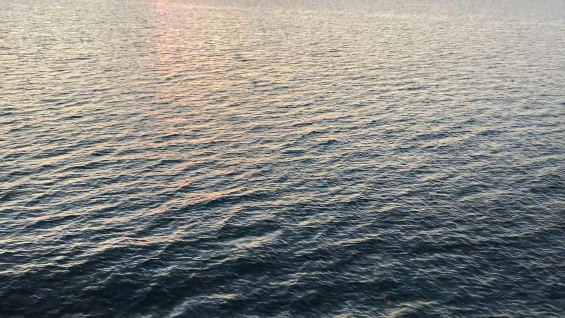 A Drone Shot of the Open Sea During Sunset · Free Stock Video