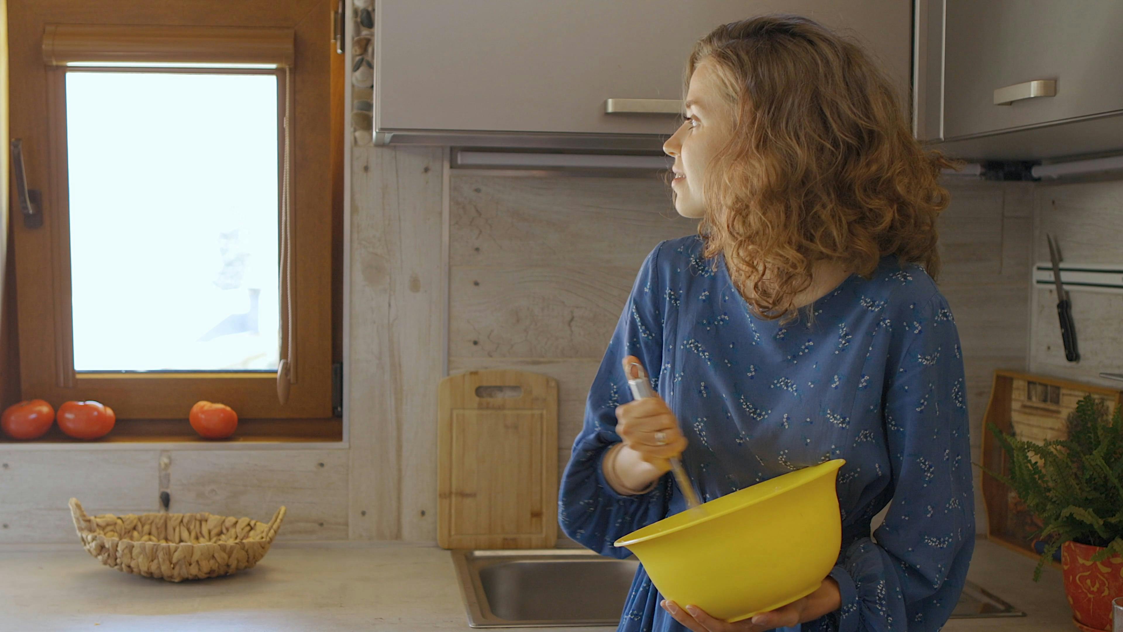 A Woman Stirring Ingredients A Bowl · Free Stock Video