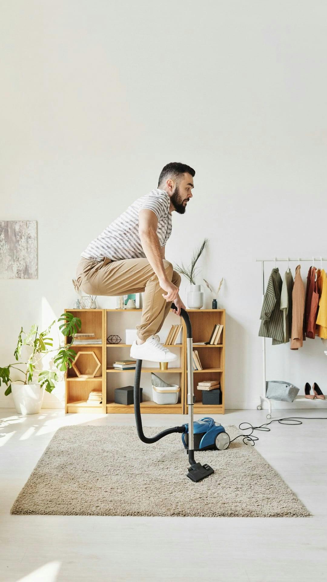 Stop Motion Video of a Man Using a Vacuum Cleaner while Floating on Air ...