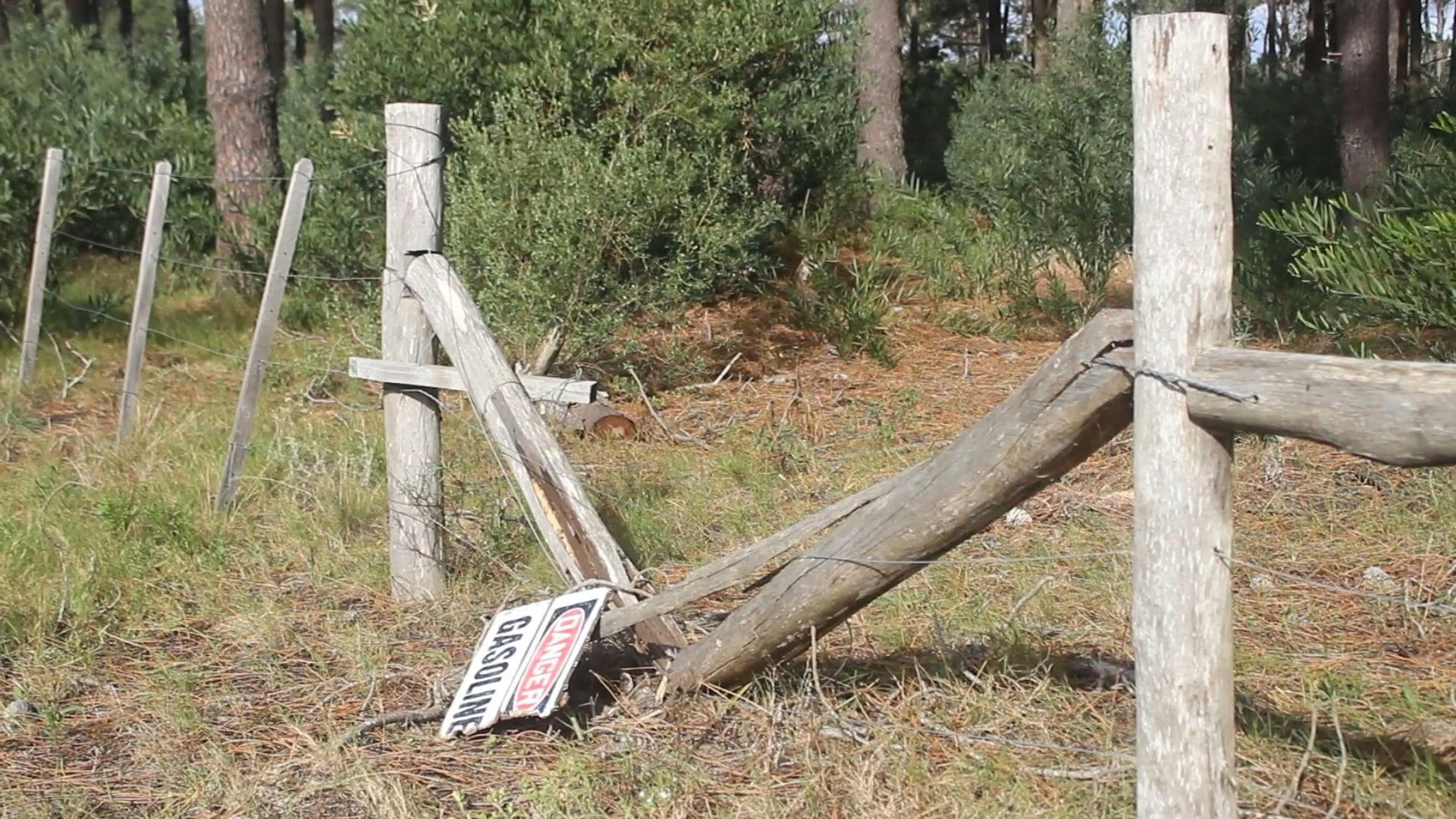 A Broken Danger Sign From A Broken Fence · Free Stock Video