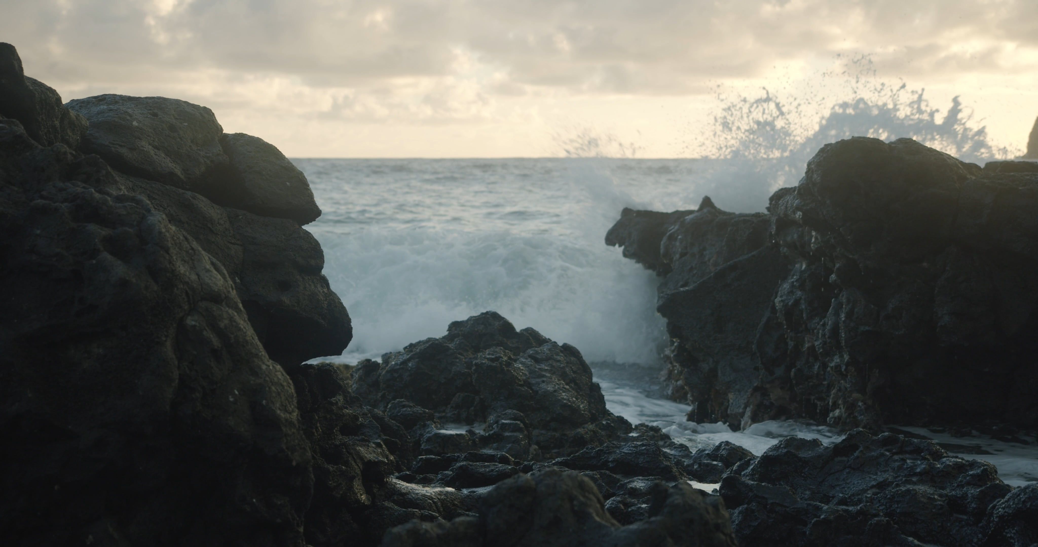 Water Waves Crashing with a Rocky Shore · Free Stock Video