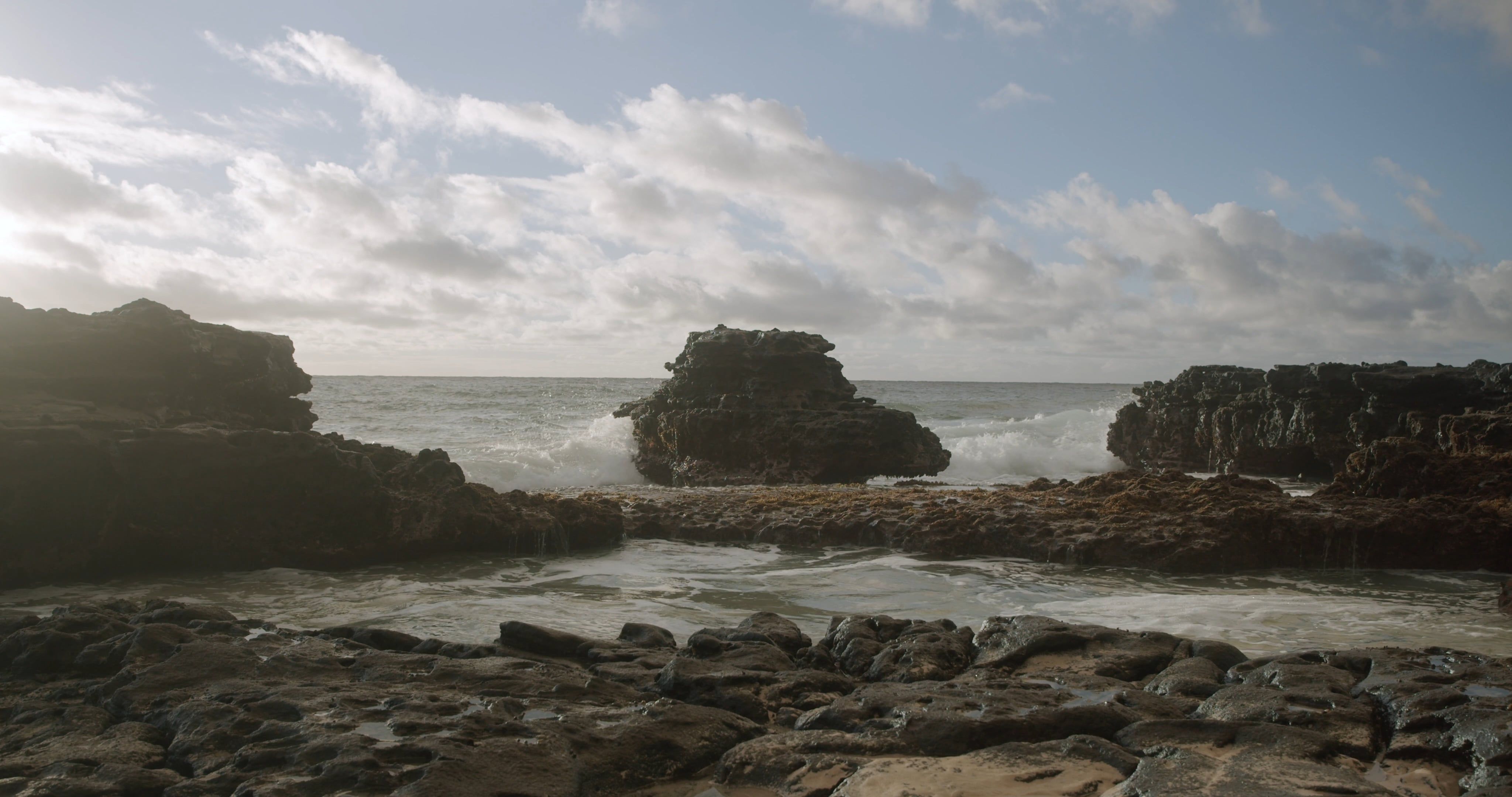 Water Waves Crashing on a Rocky Shore · Free Stock Video