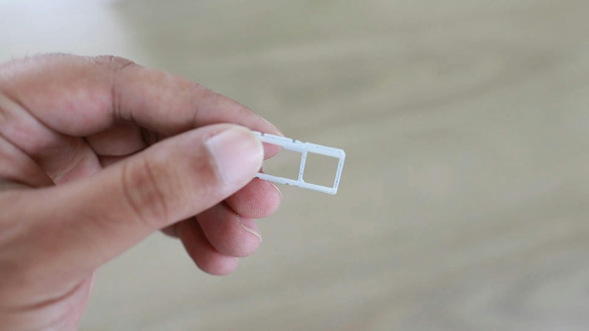 A Person Holding a Dual Sim Card Holder Slot Free Stock Video Footage ...