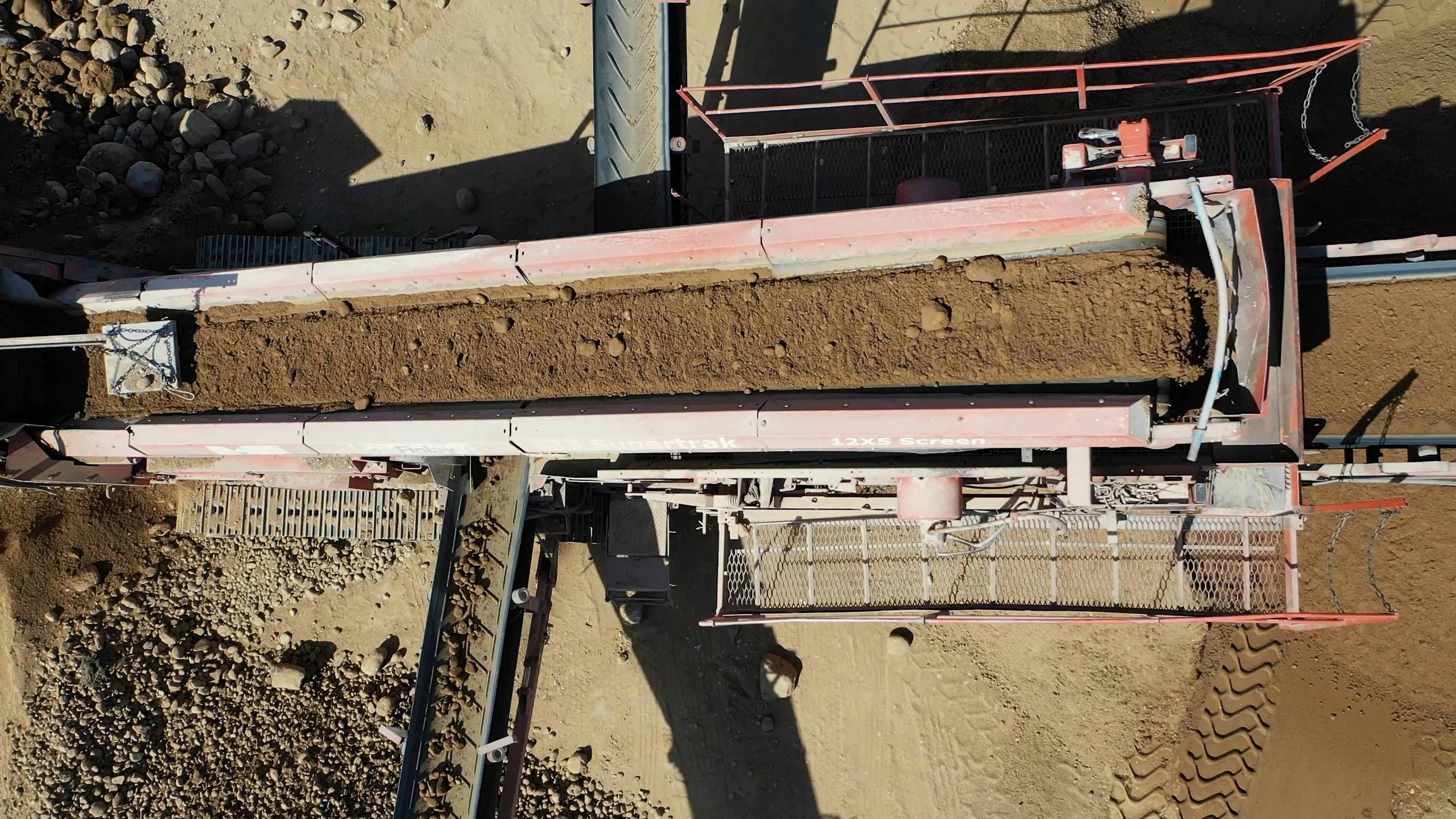 Drone Footage of a Machine Separating Rocks from Soil · Free Stock Video