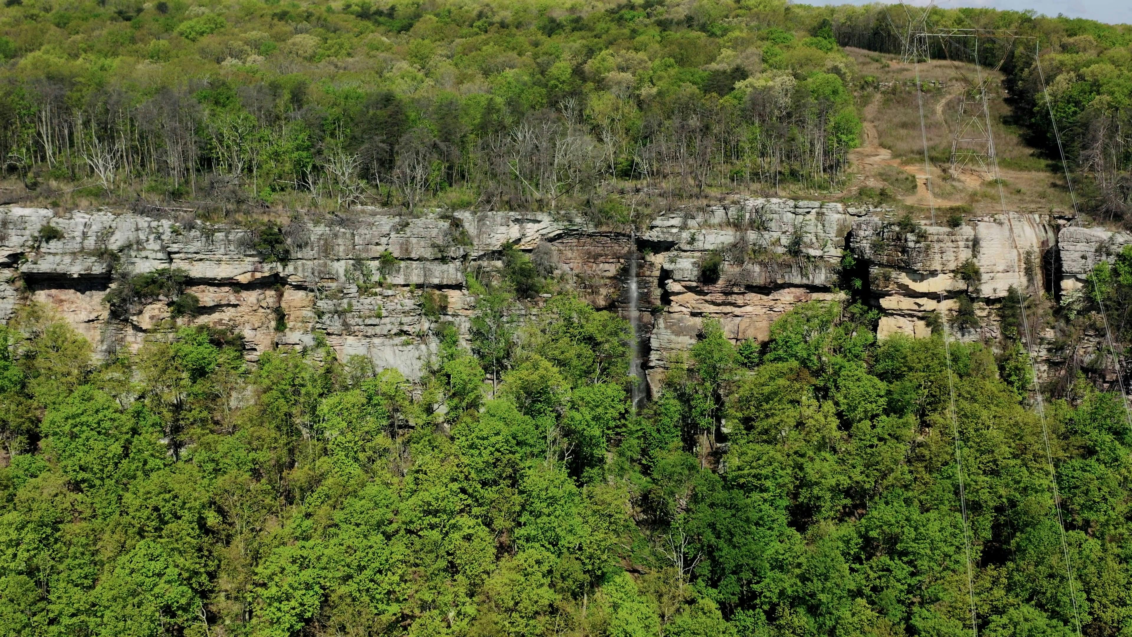 A Waterfalls From The Cliff Of A Mountain Forest · Free Stock Video