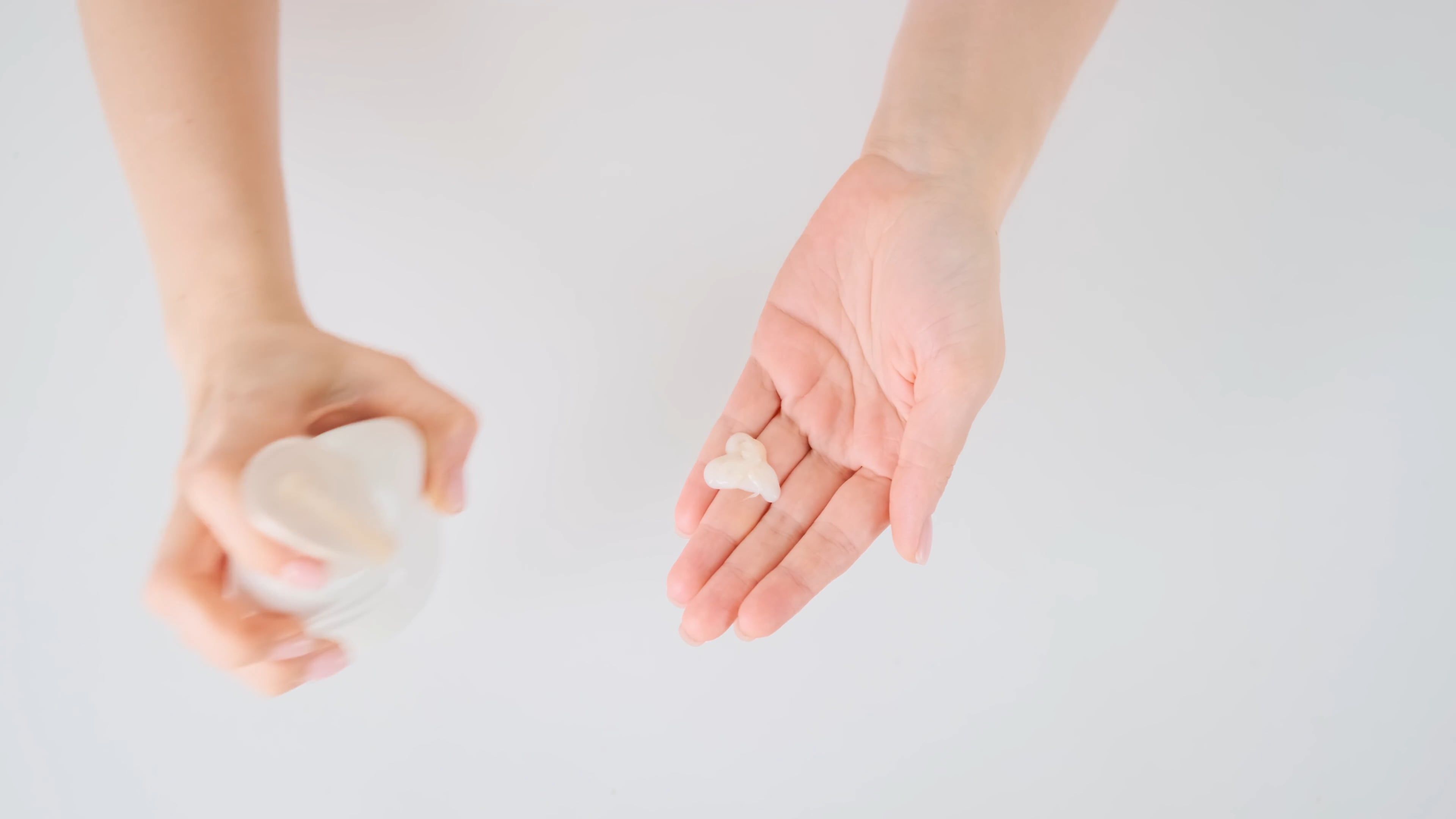 Person Rubbing Lotion On Hands · Free Stock Video