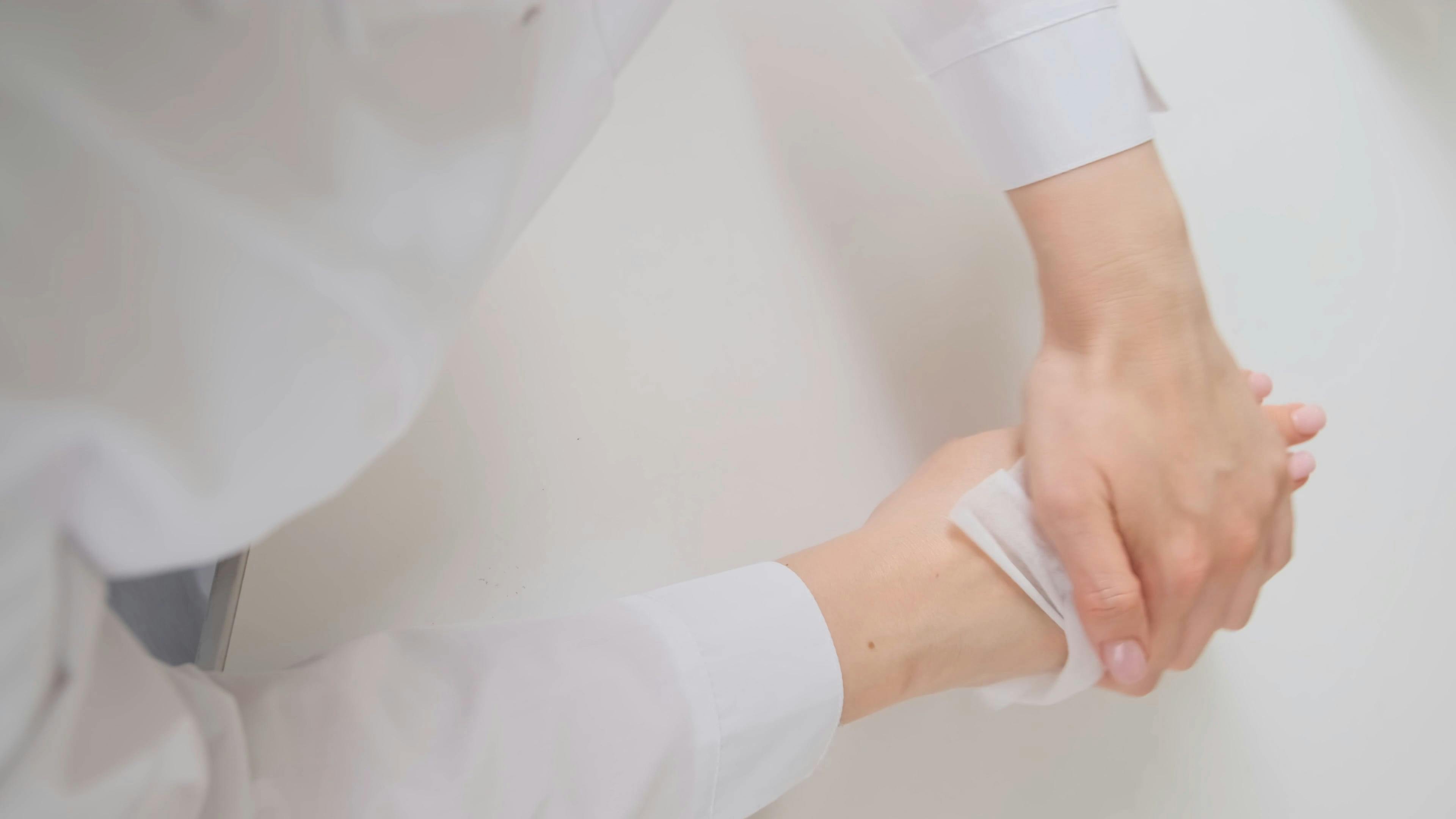 Person Wiping Her Hands With Wipes After Washing Free Stock Video ...