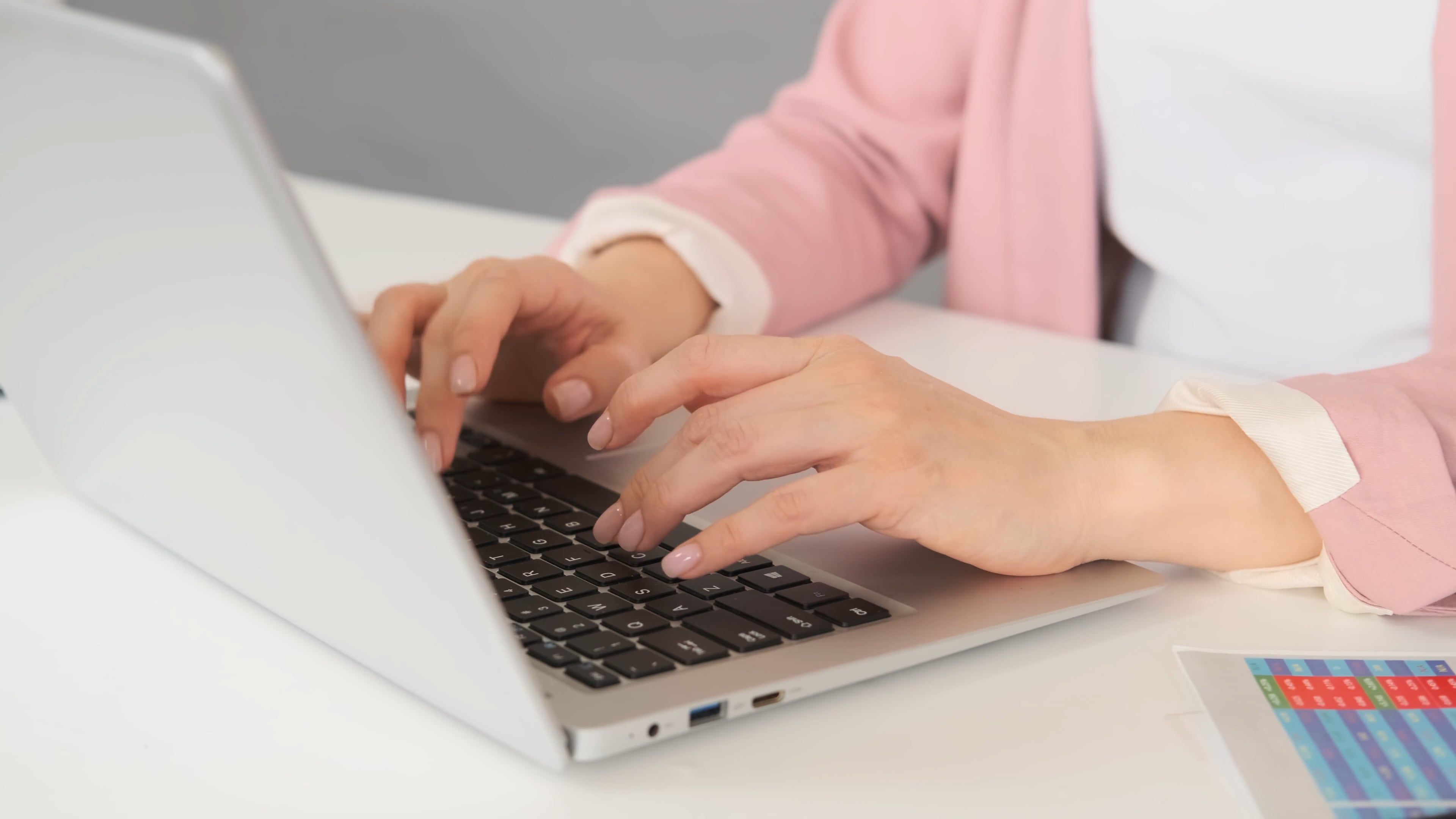 A Woman Disinfecting Her Hands In Using A Laptop Free Stock Video ...