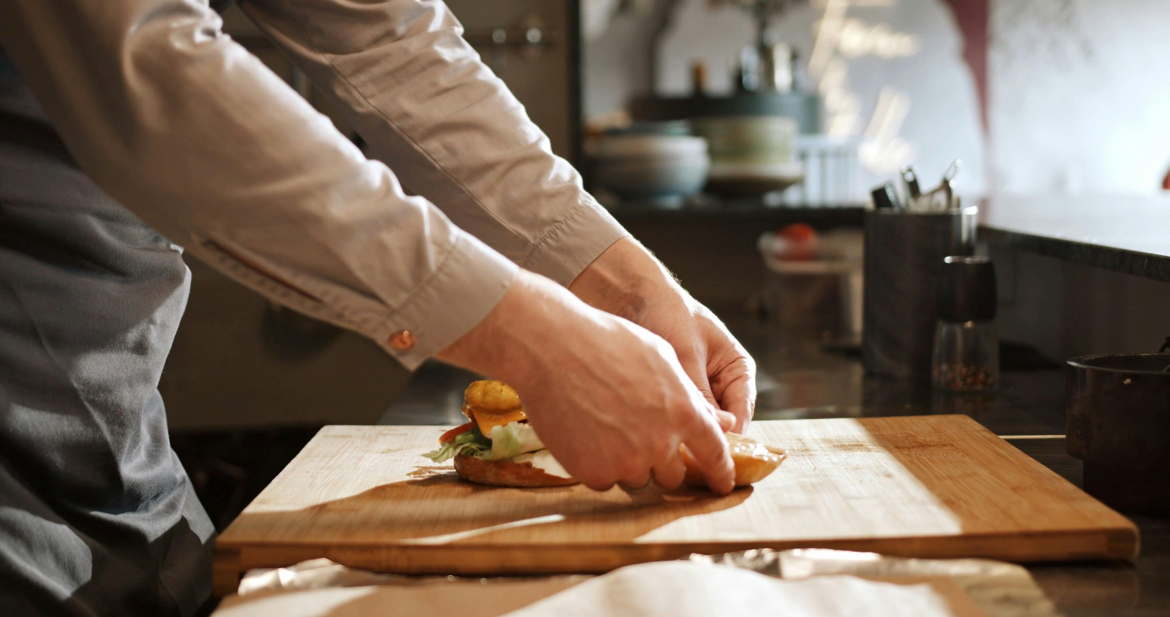 A person is cutting a piece of paper with scissors Free Stock Video ...