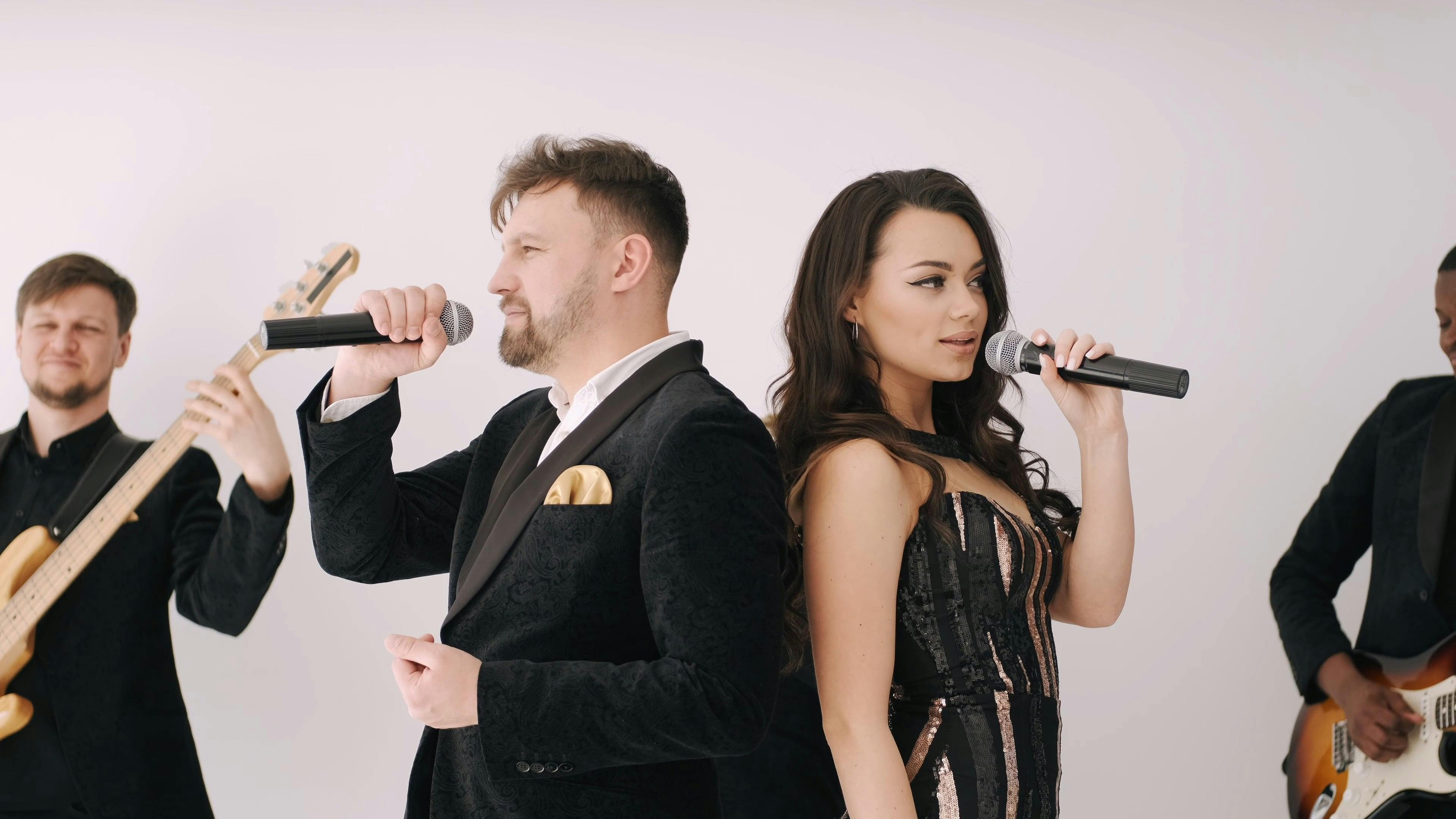 A Band Playing A Duet By The Male And Female Singers Free Stock Video ...