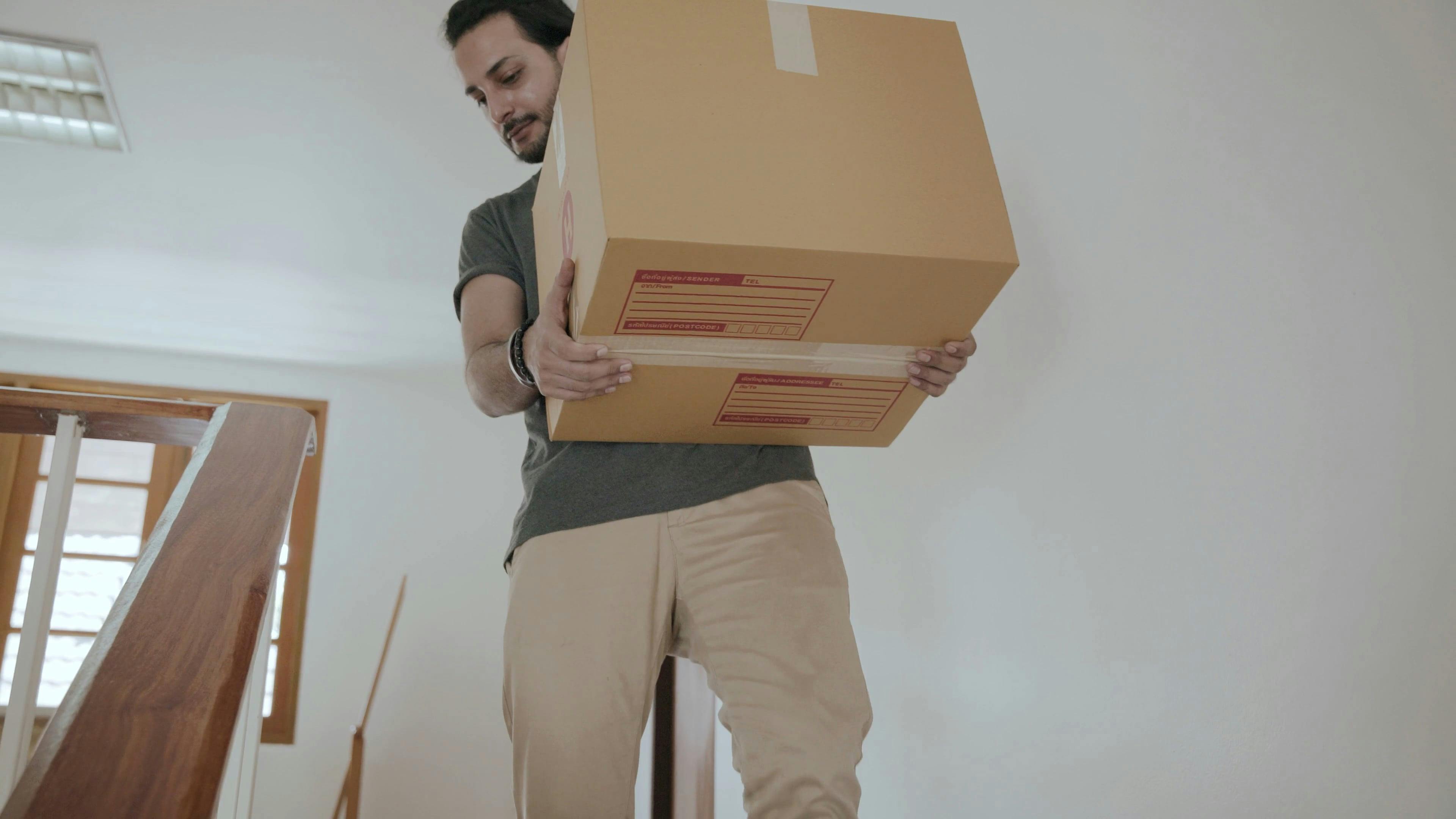 Man Carrying A Box Downstairs Free Stock Video Footage, Royalty-Free 4K ...