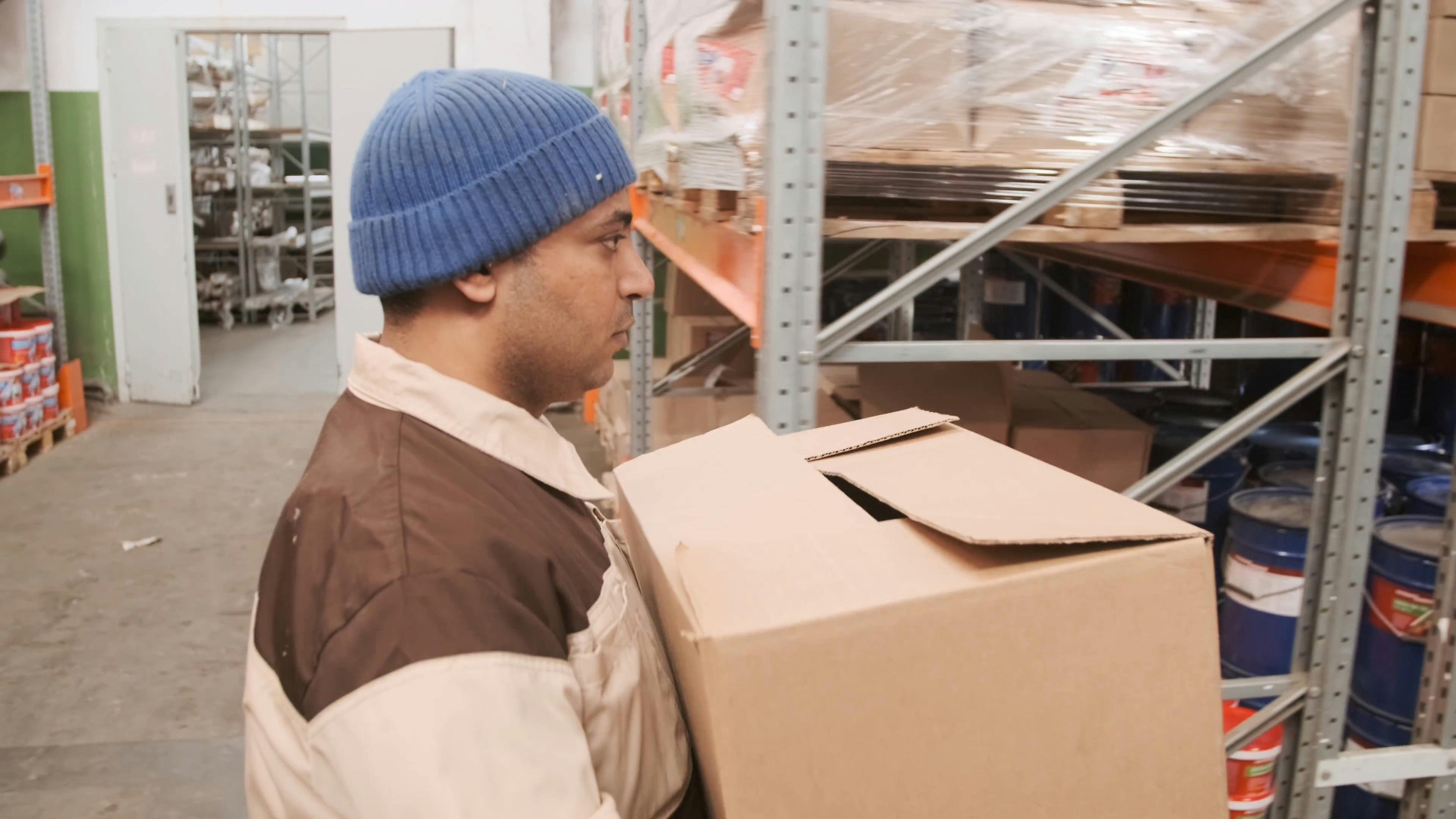 Man Lifting Boxes inside the Warehouse Free Stock Video Footage ...