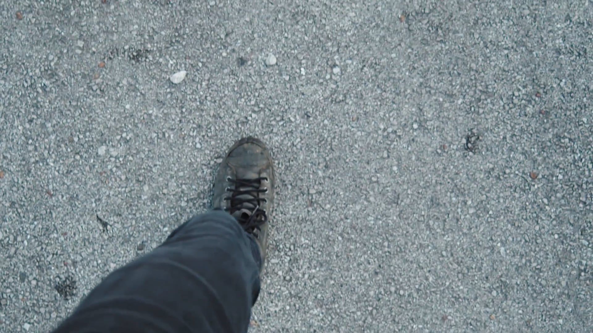 A Person Holding a Camera While Looking Down and Walking Free Stock ...