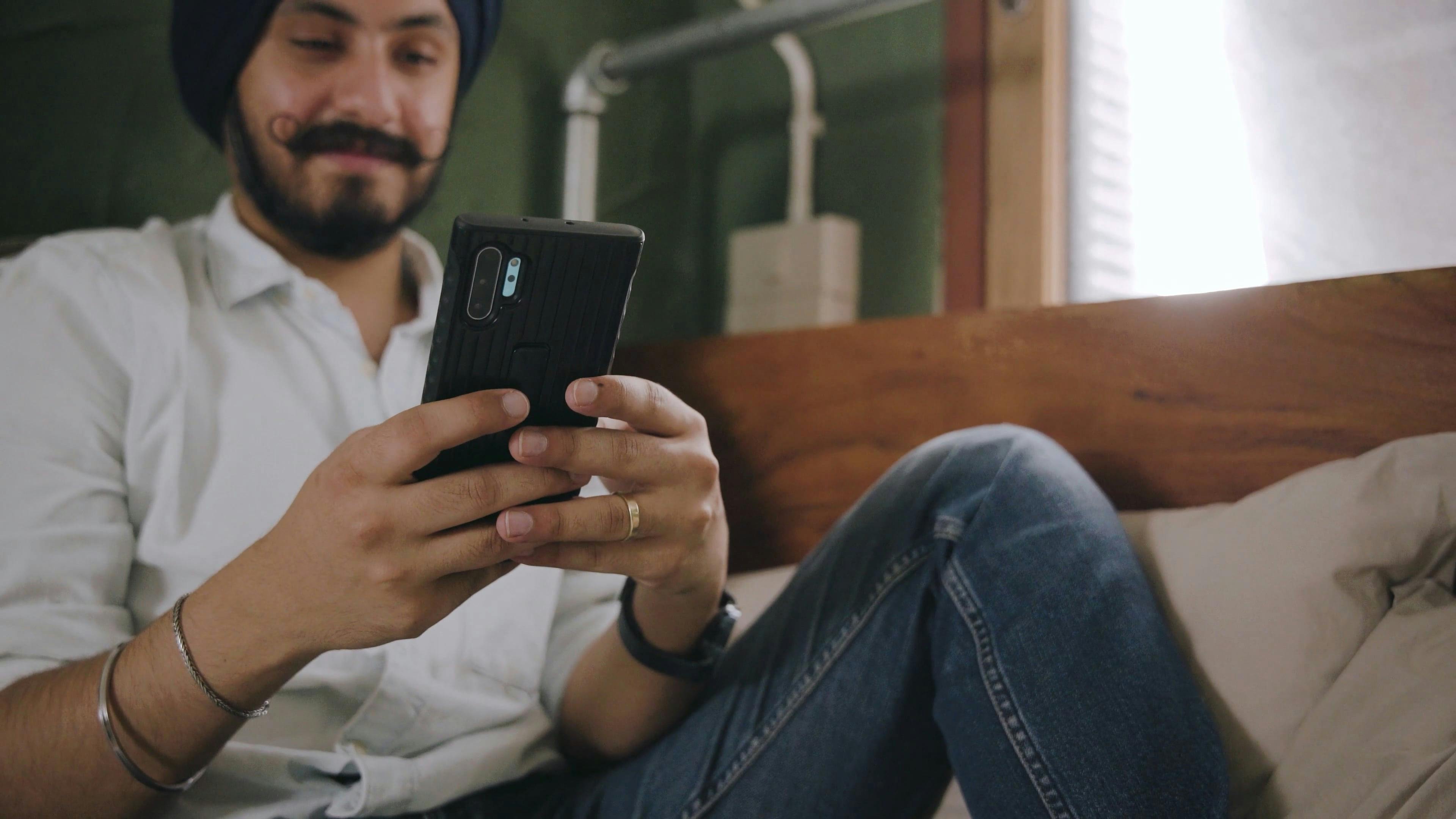 A Man Using a Smartphone · Free Stock Video